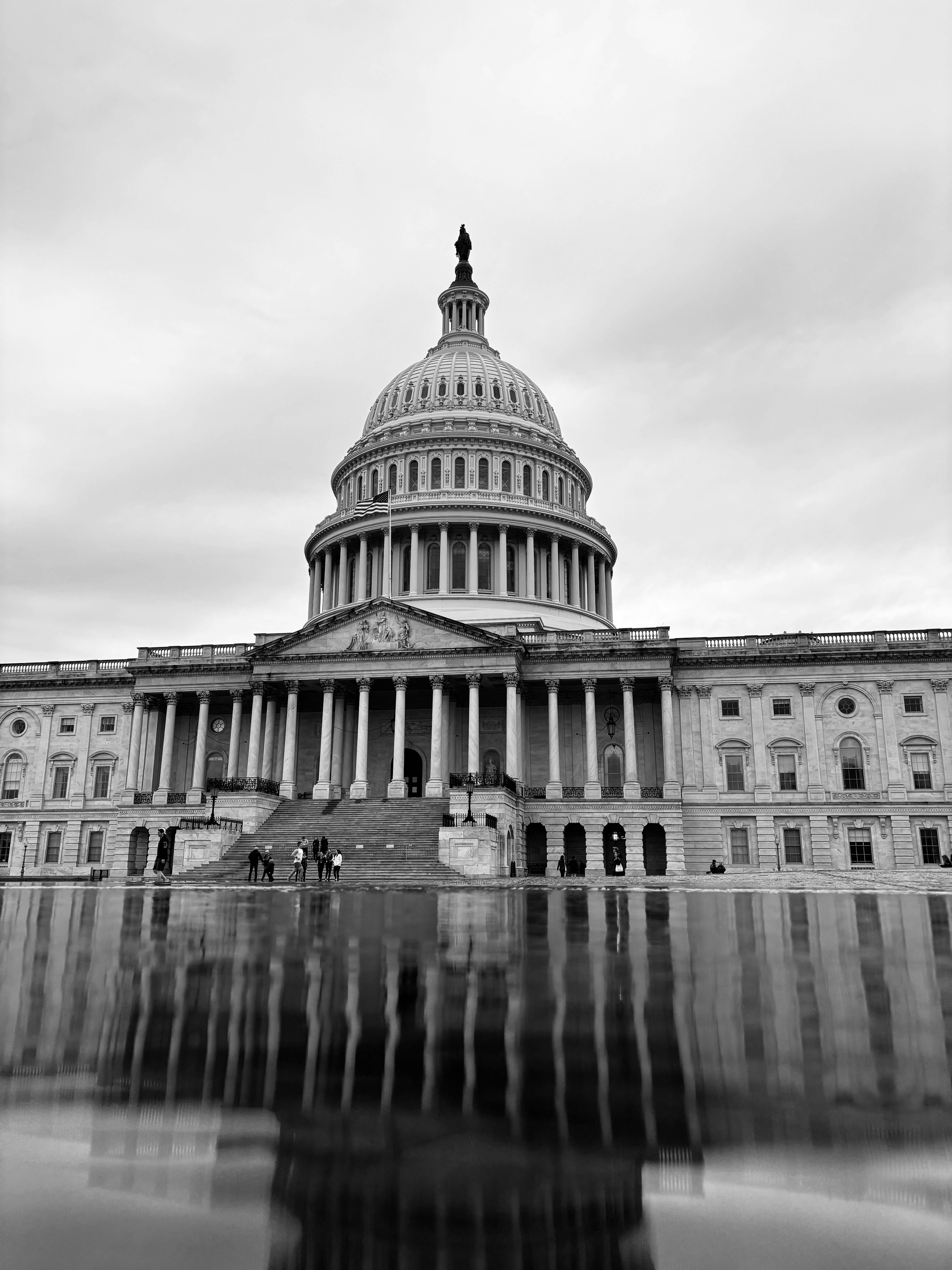 Capitol Facade in Stillness: A Reflected Moment