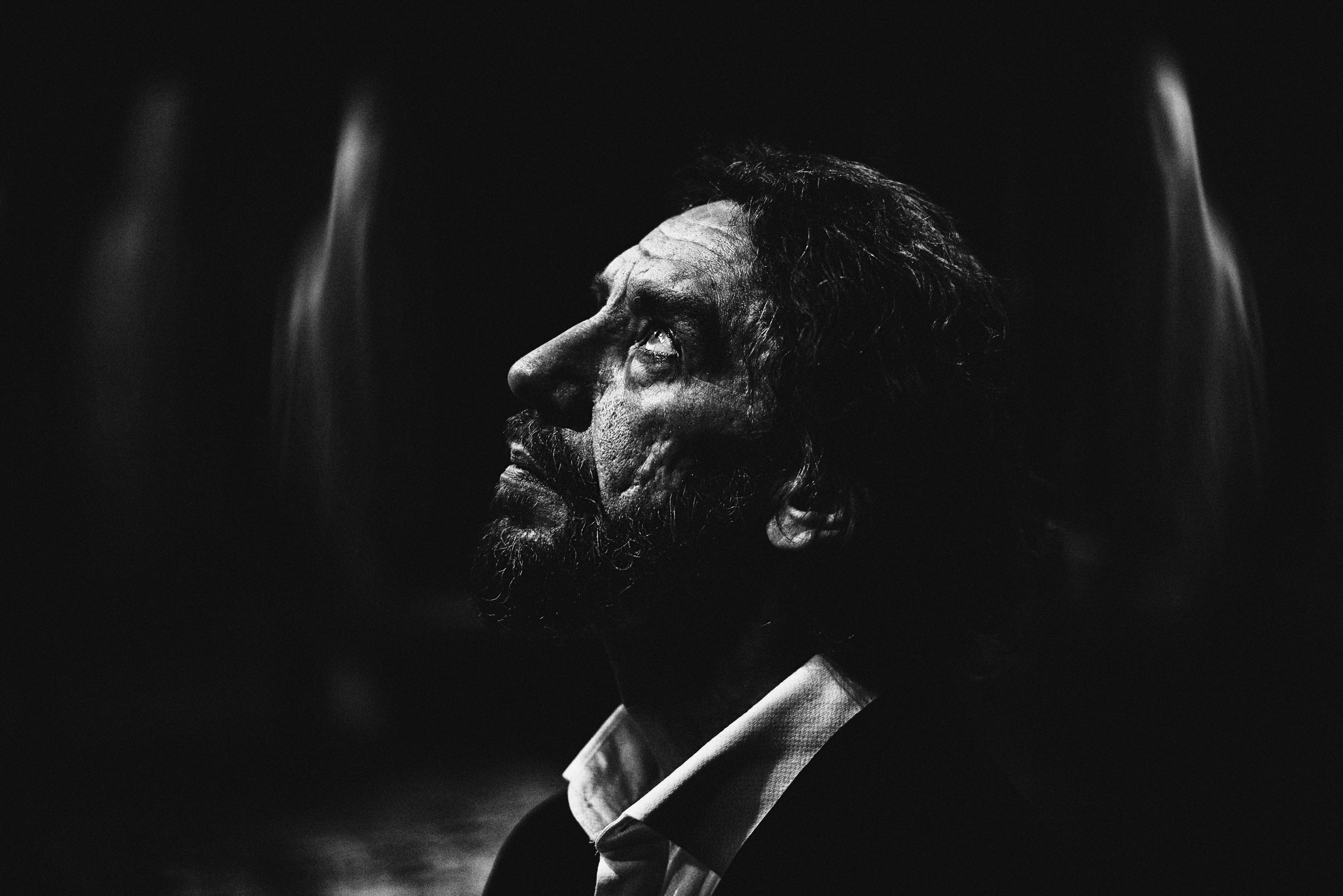 Rising Gaze: A Portrait in Dim Light