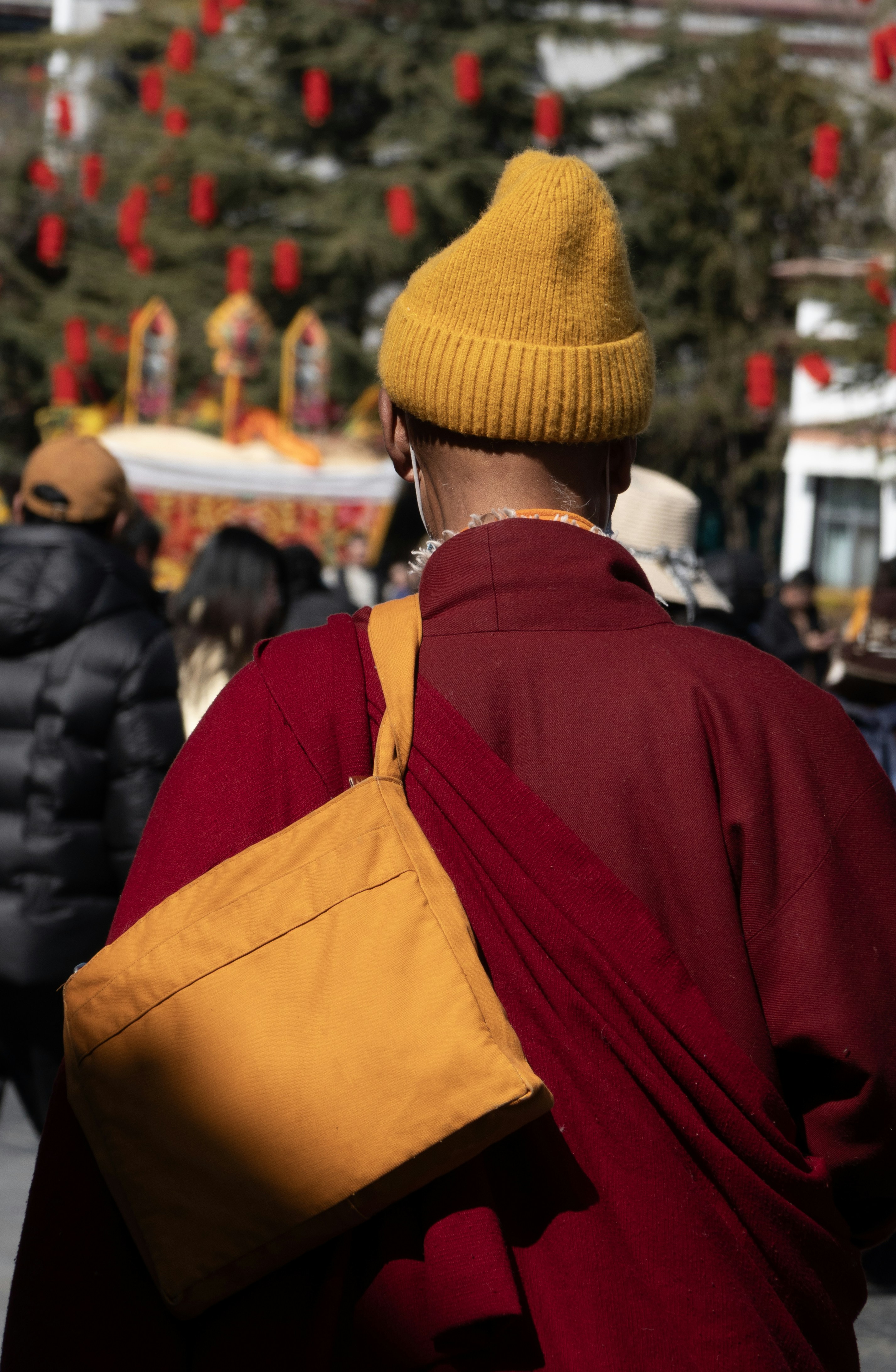 Yellow Beanie in a Sea of Red Lanterns