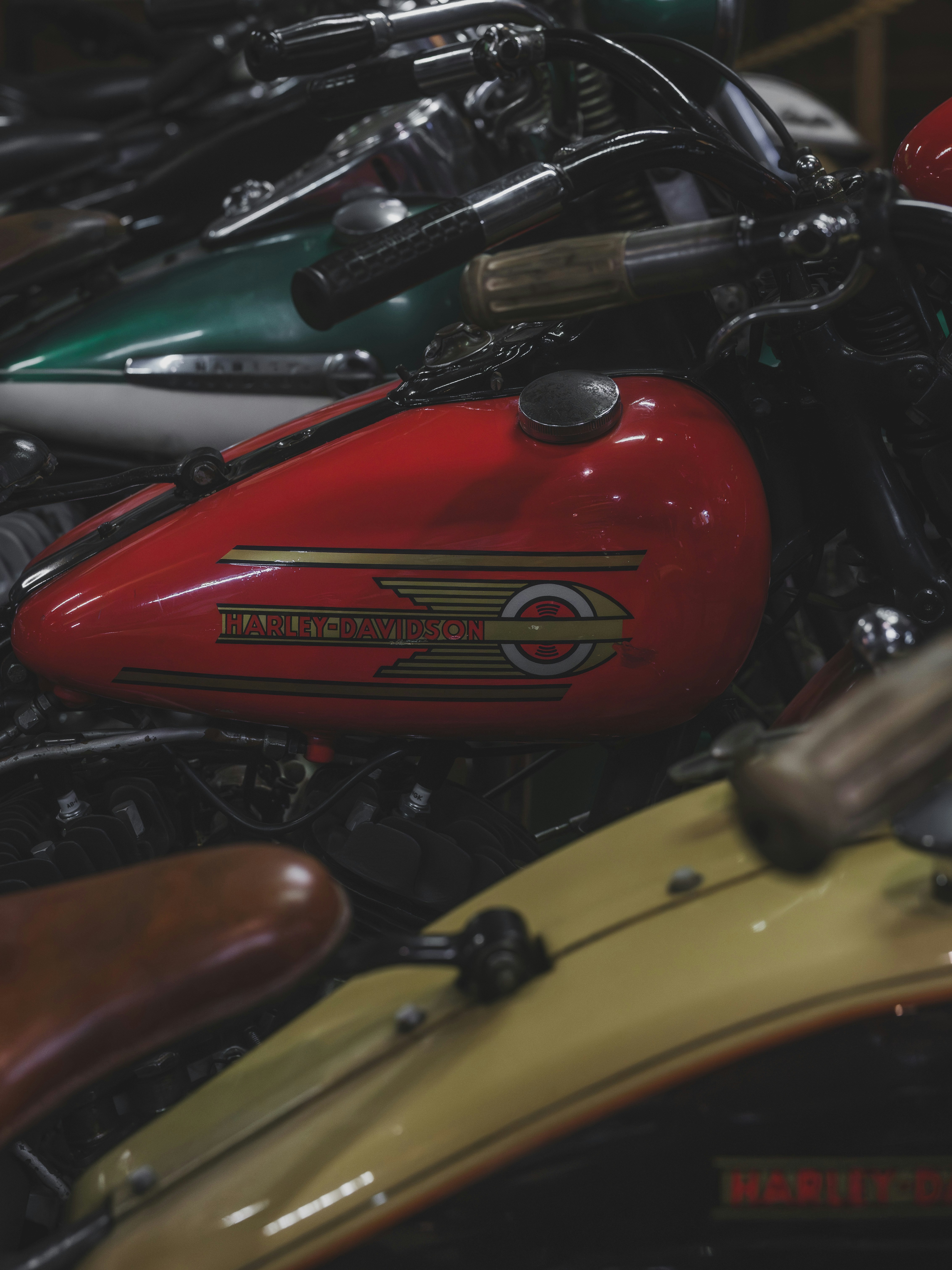 Red Harley Tank Piercing Through a Sea of Vintage Bikes