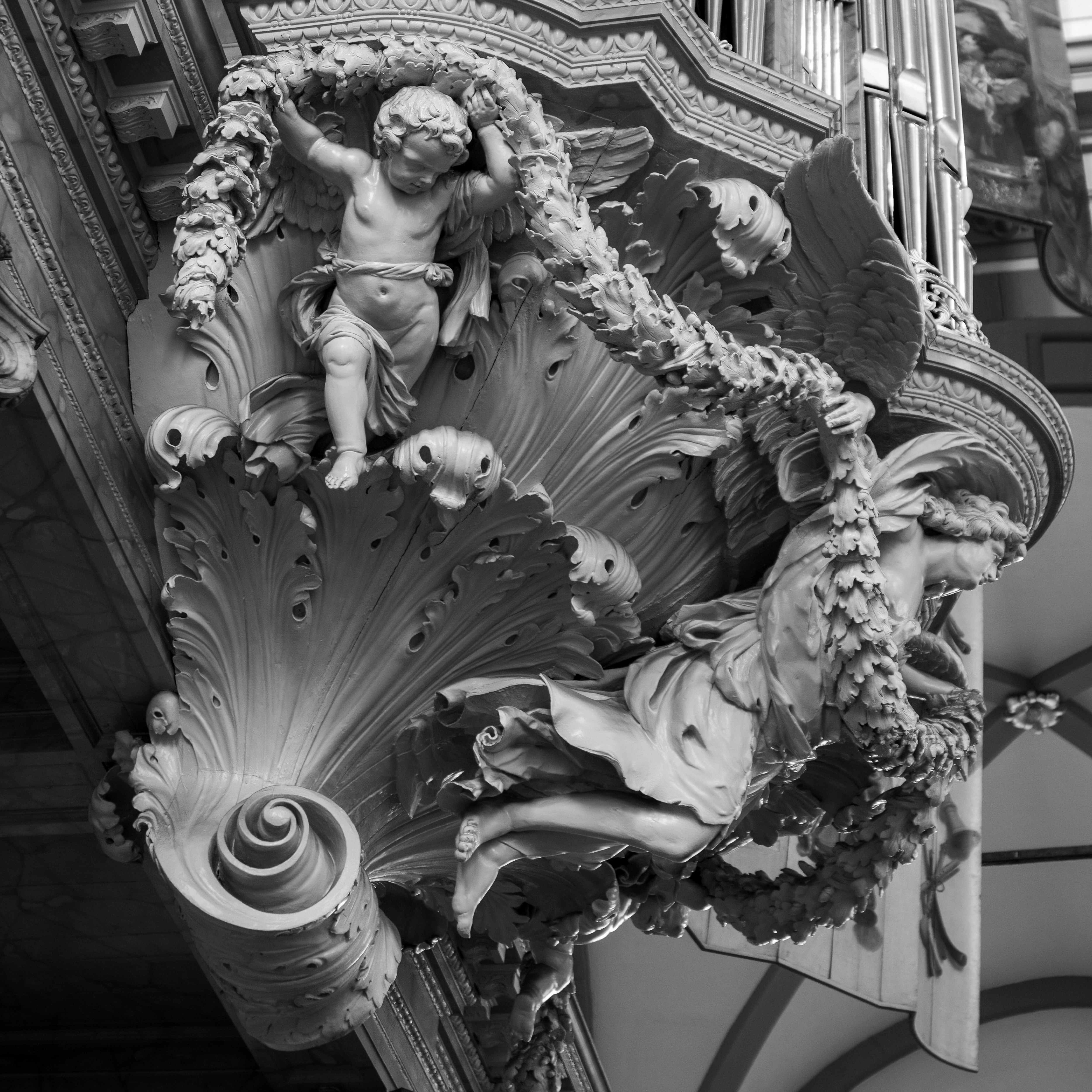 Baroque Angelic Sculptures Draped in Ornate Shells on a Carved Architectural Underpinning