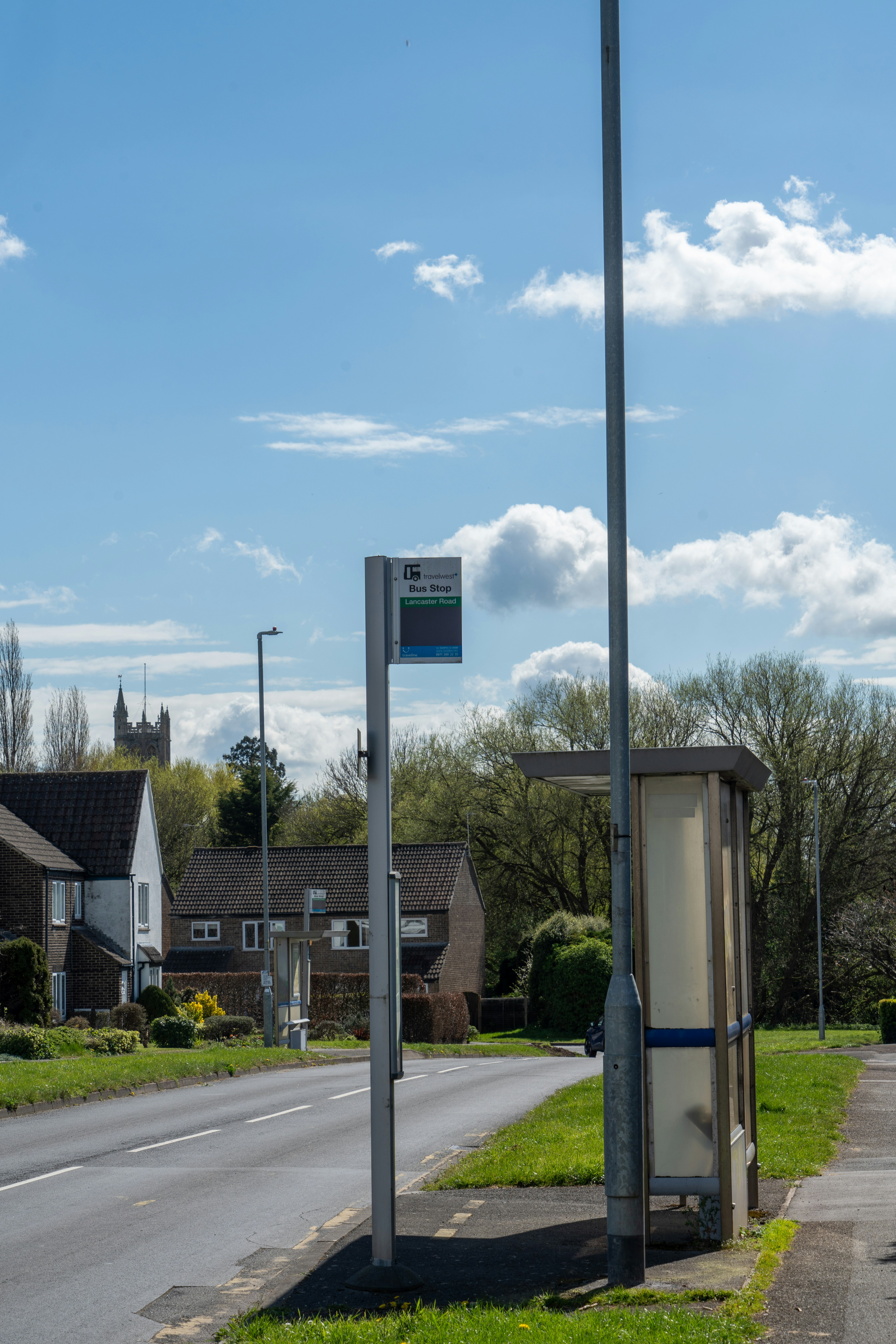 Bus Stop Silhouette Along a Quiet Suburban Street