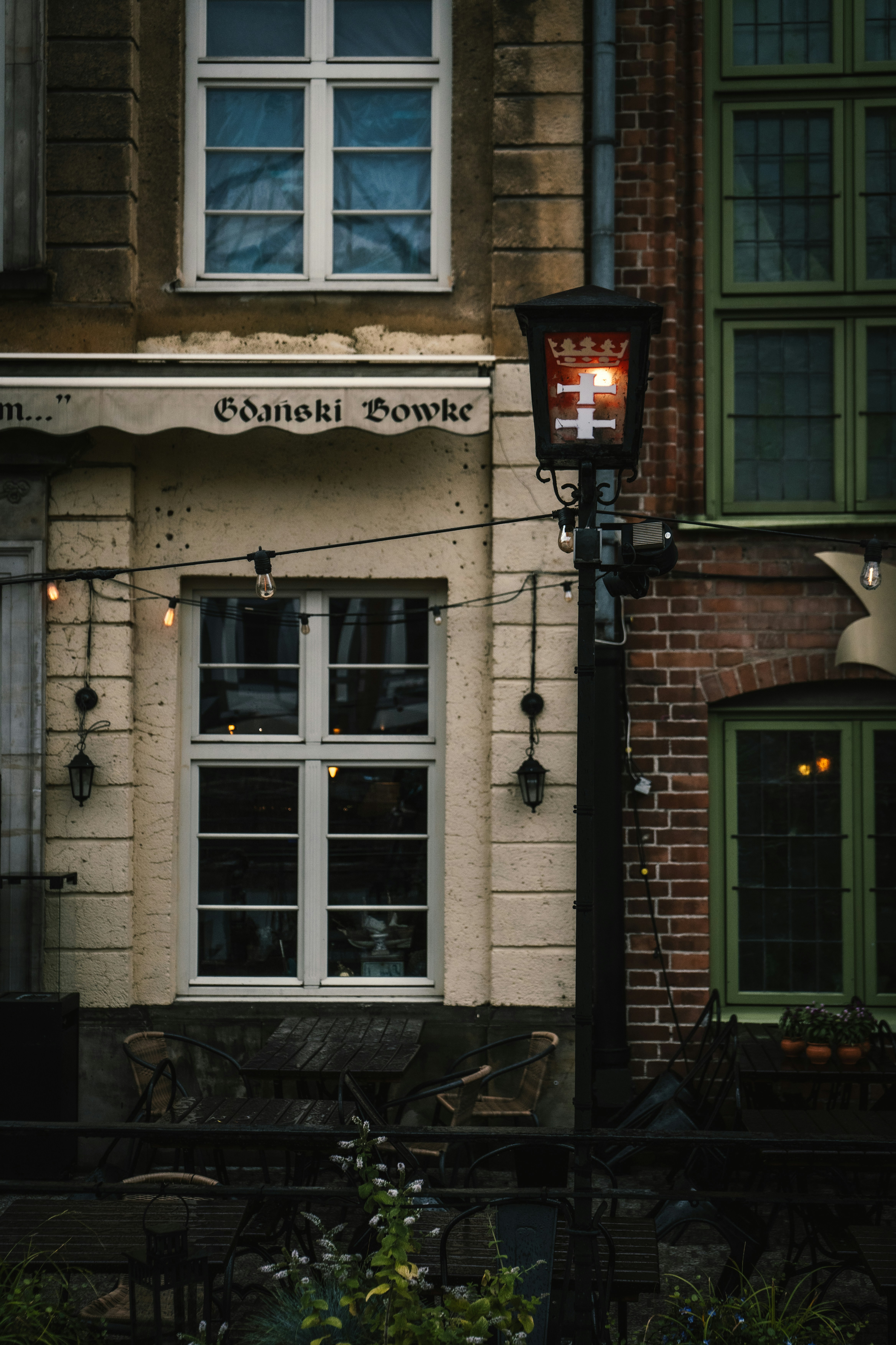 Cafe Lantern on a Cobblestone Street