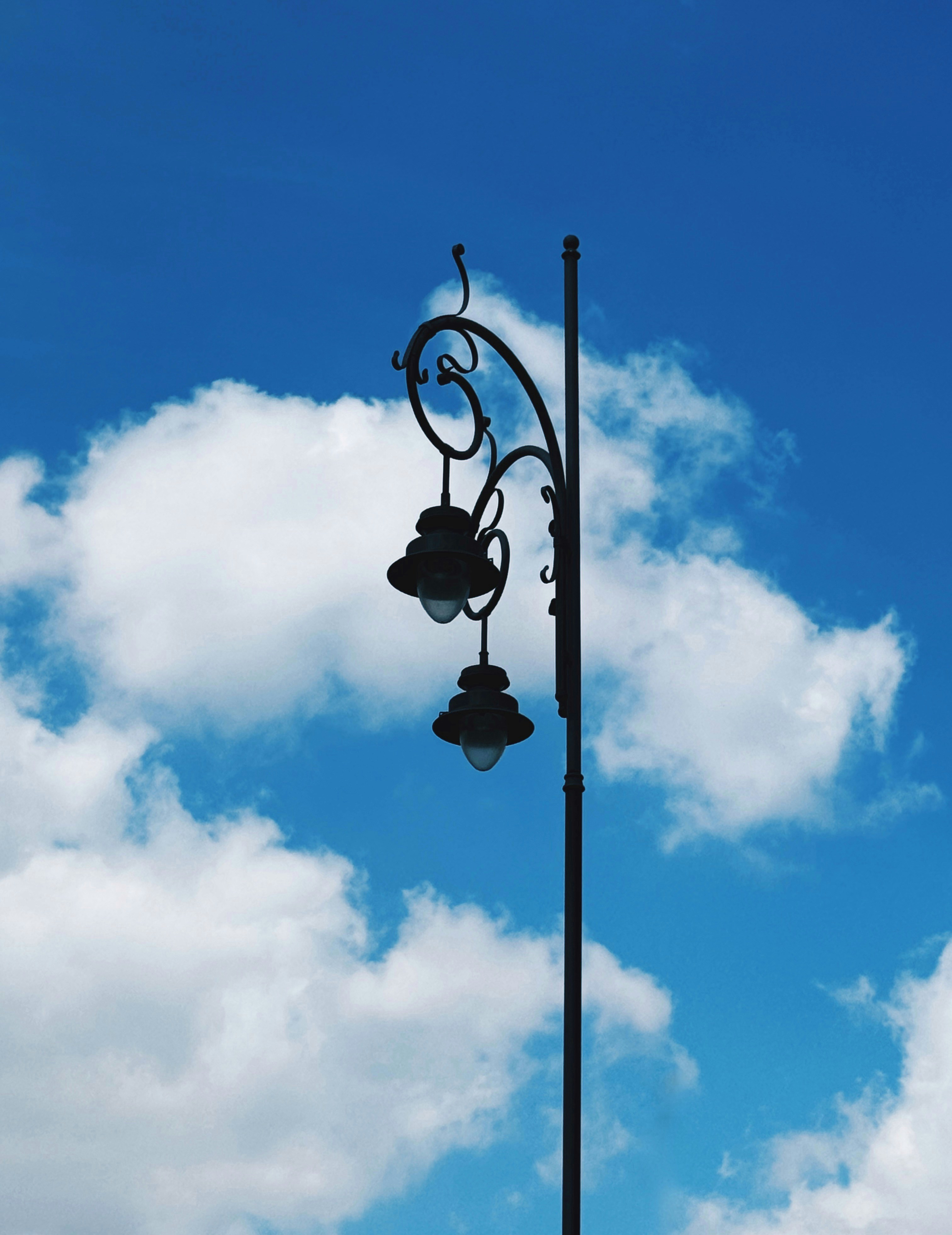 Ornate Lantern Against a Sky of Clouds