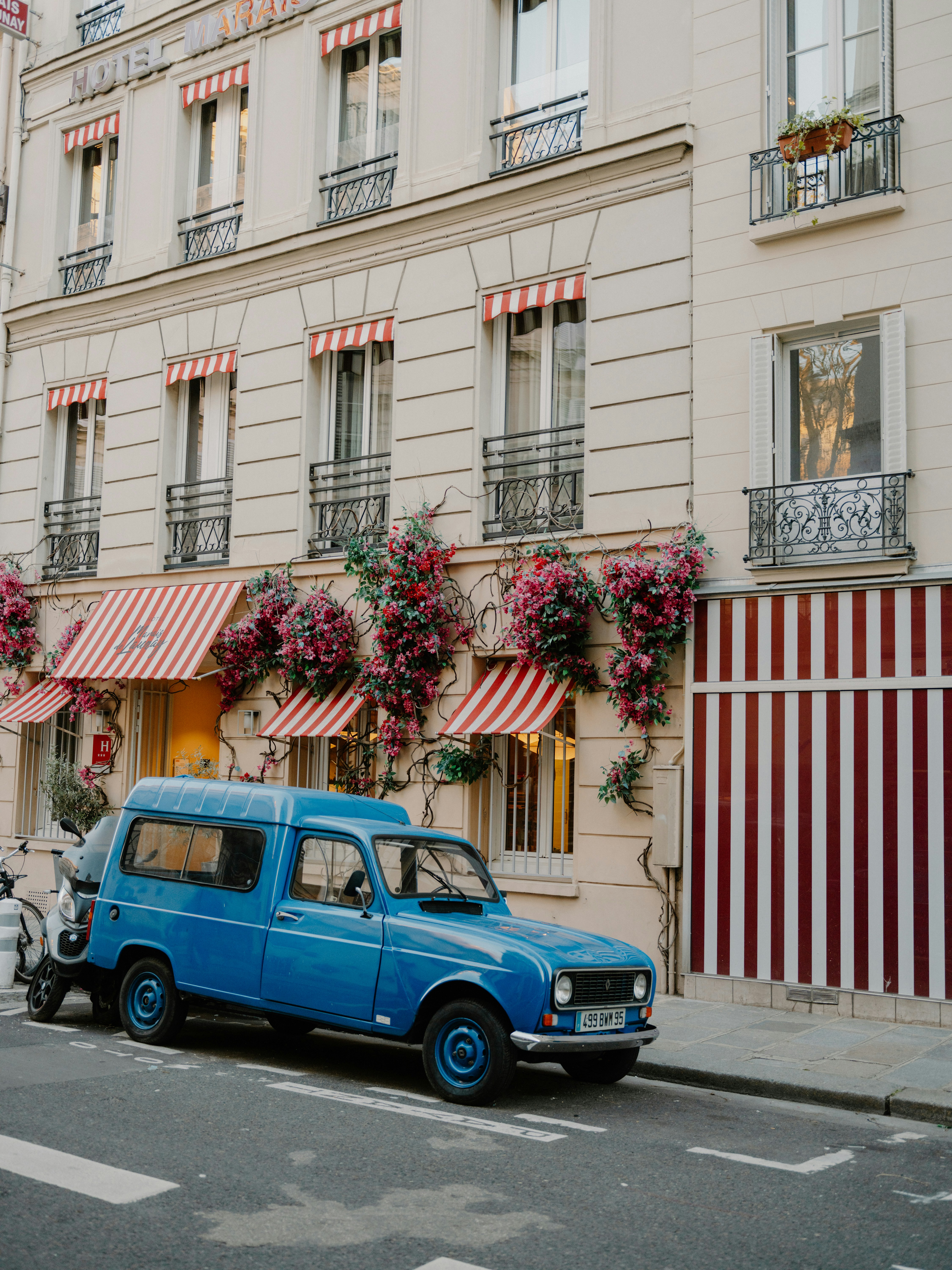 Blue vintage van trims the Parisian pastel street
