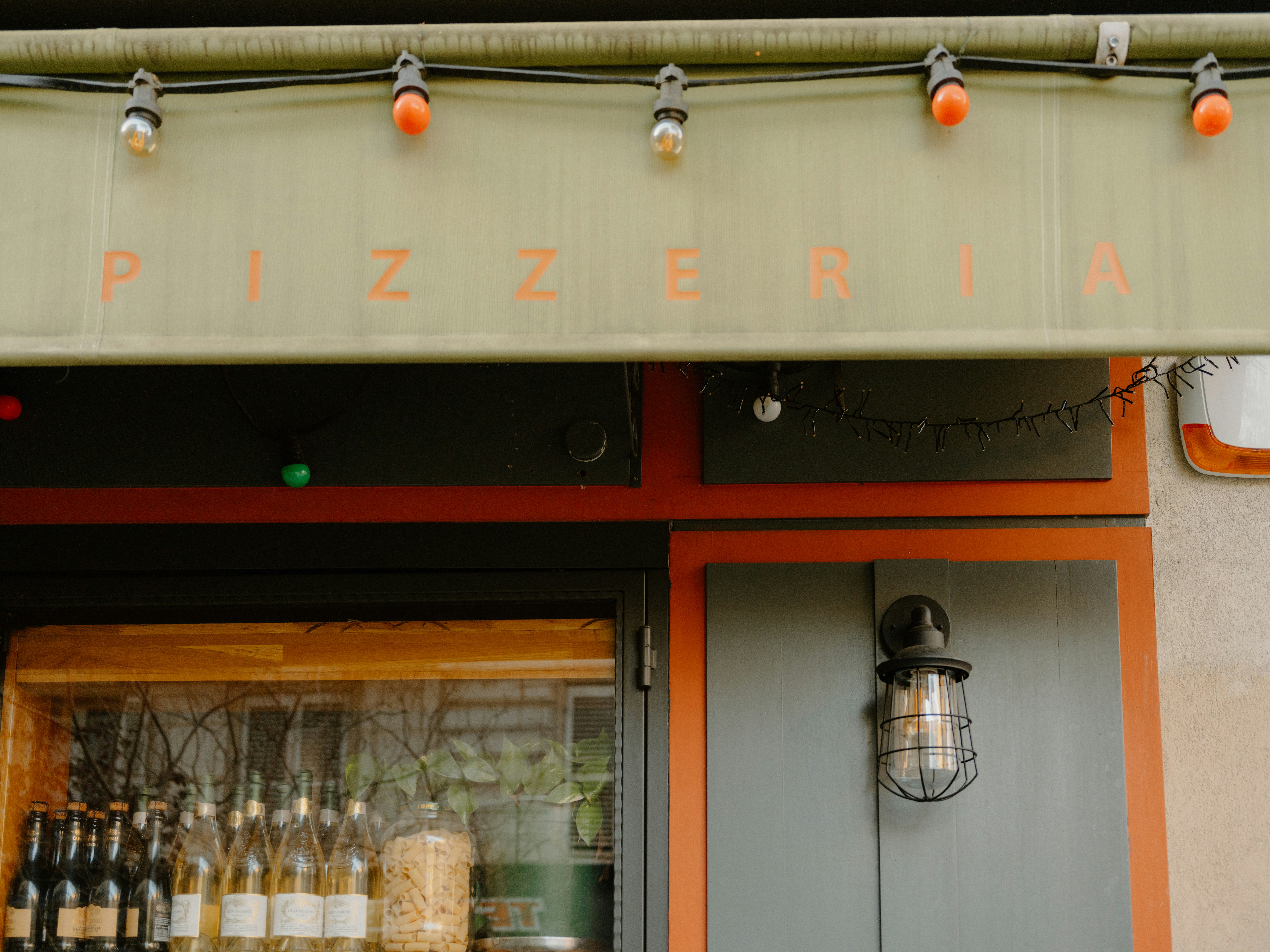 Soft glow of a quaint storefront: a corner of a vintage wine shop
