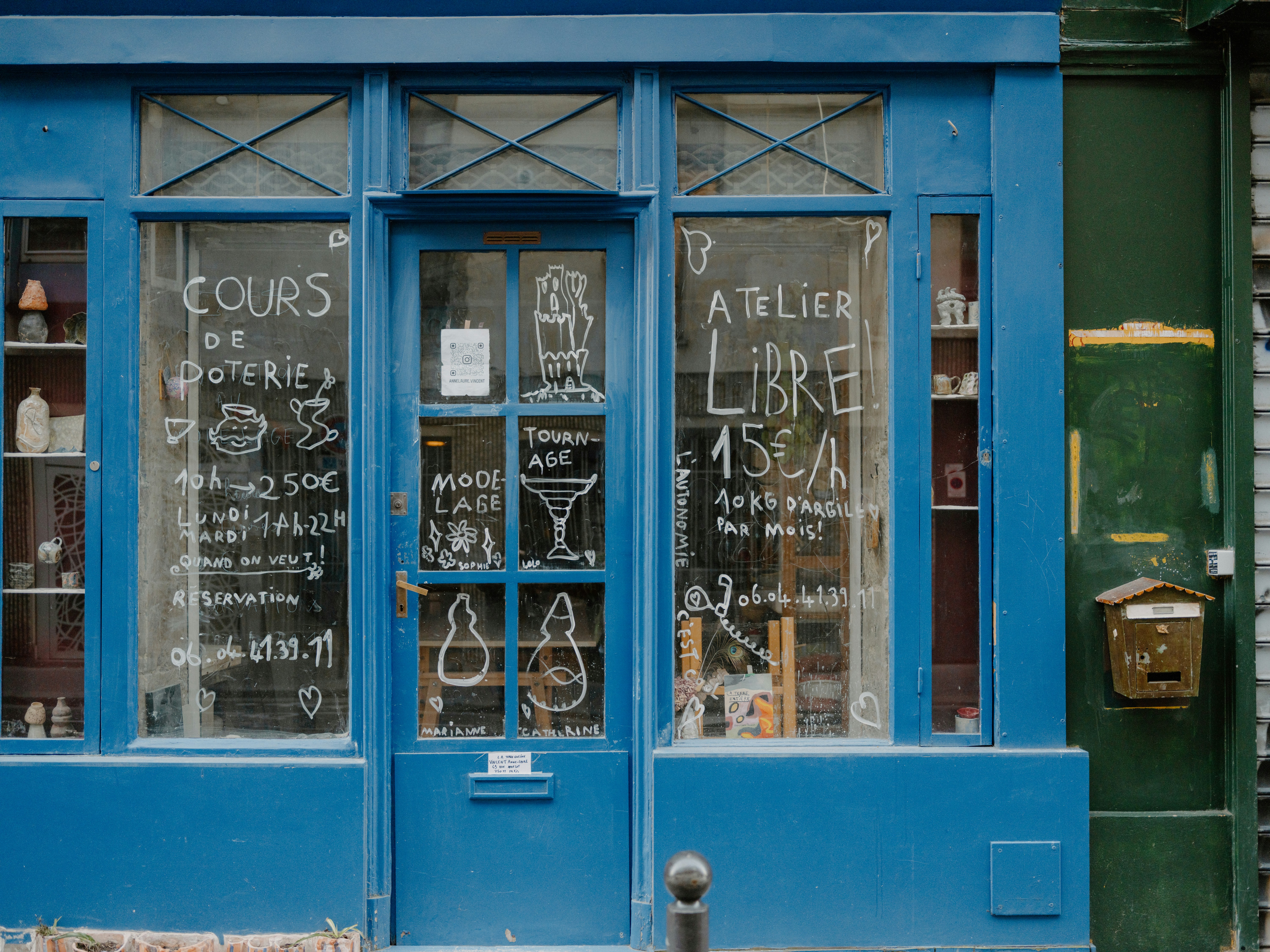 Blue storefront with chalk-written display windows