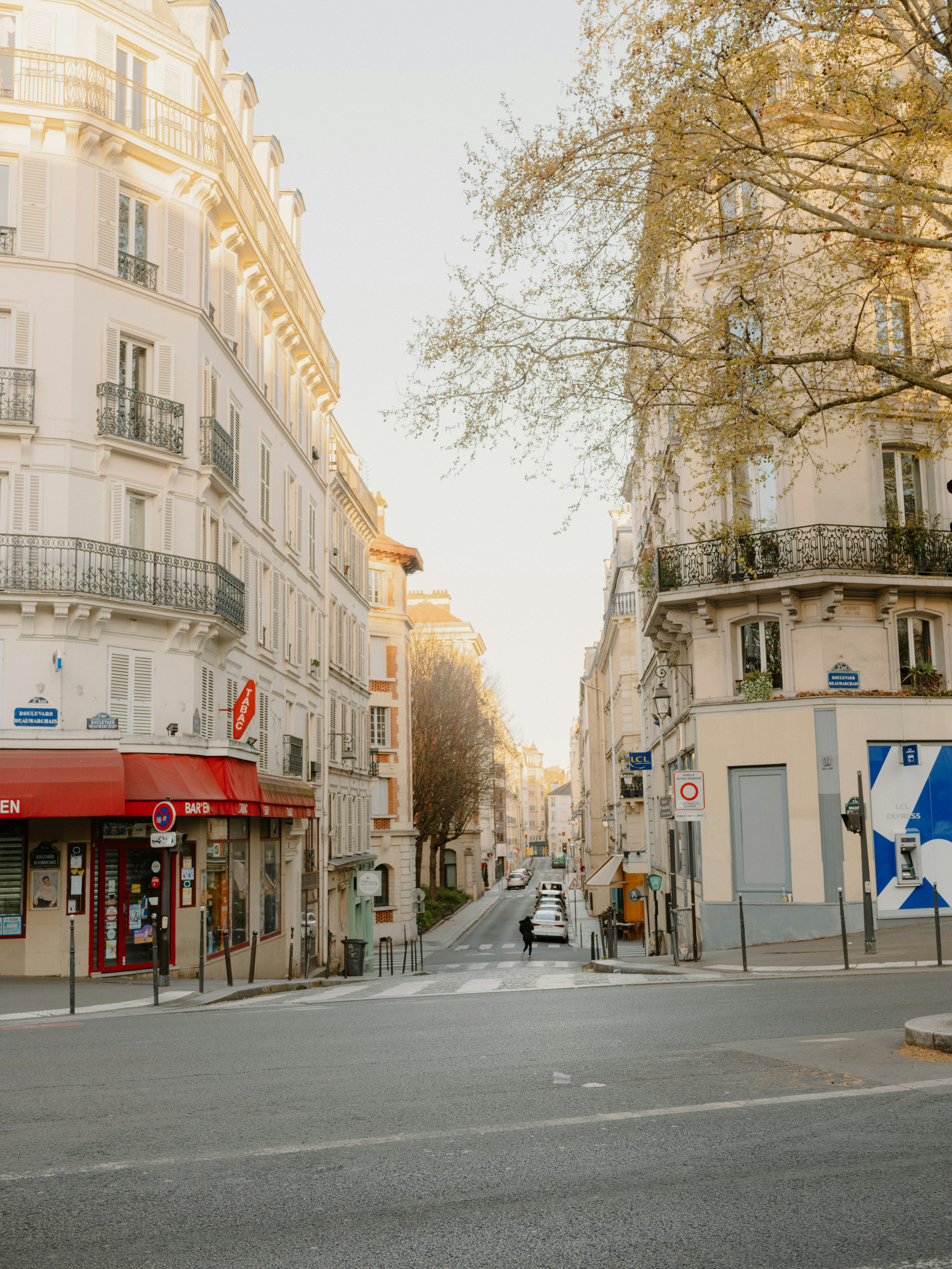 Sunlit Parisian Street Quietly Awakens