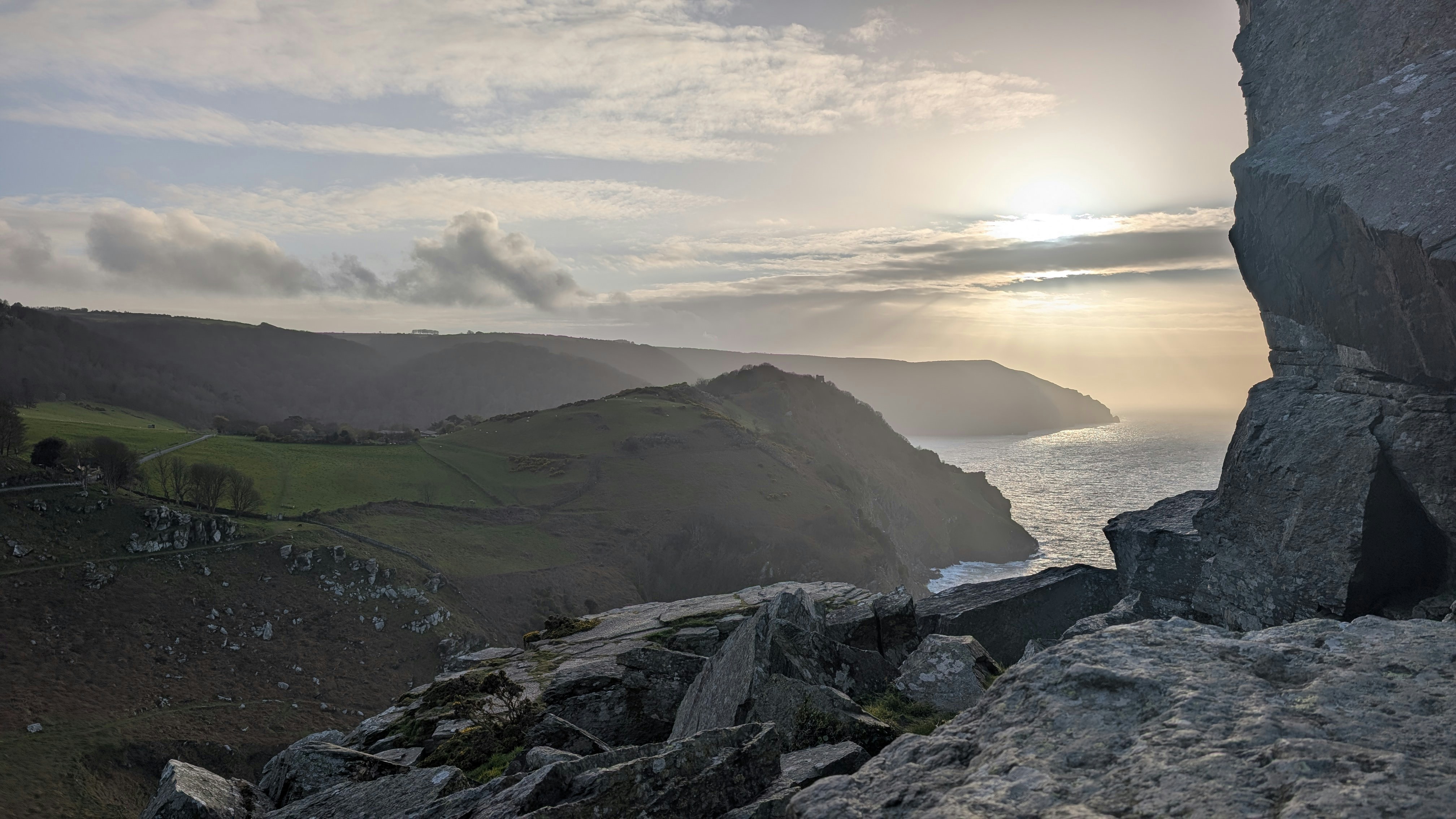 Sunlit Edge: Cliffside Coastal Panorama at Dusk