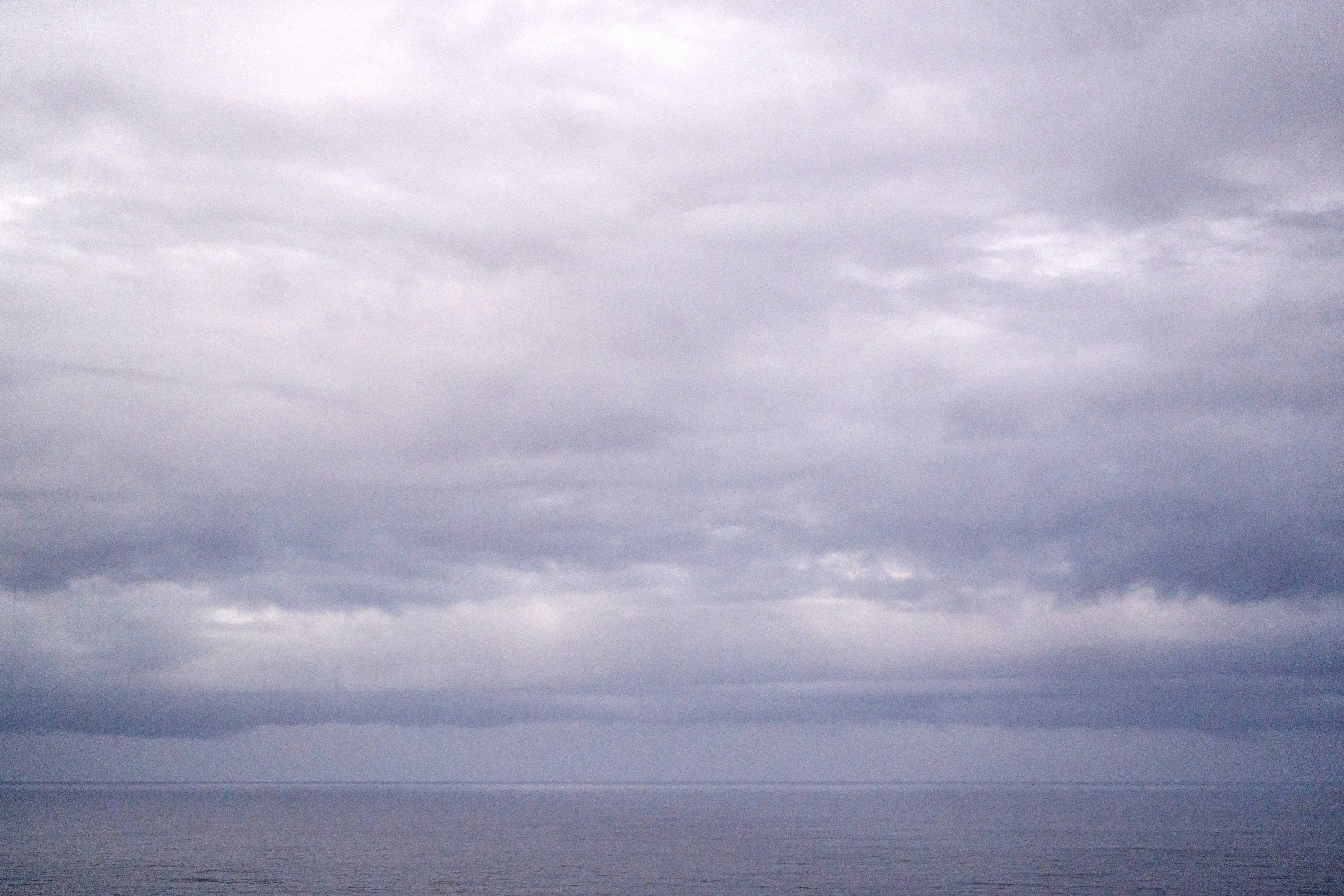 Horizon Slumber: Quiet Seas Beneath a Layered Sky