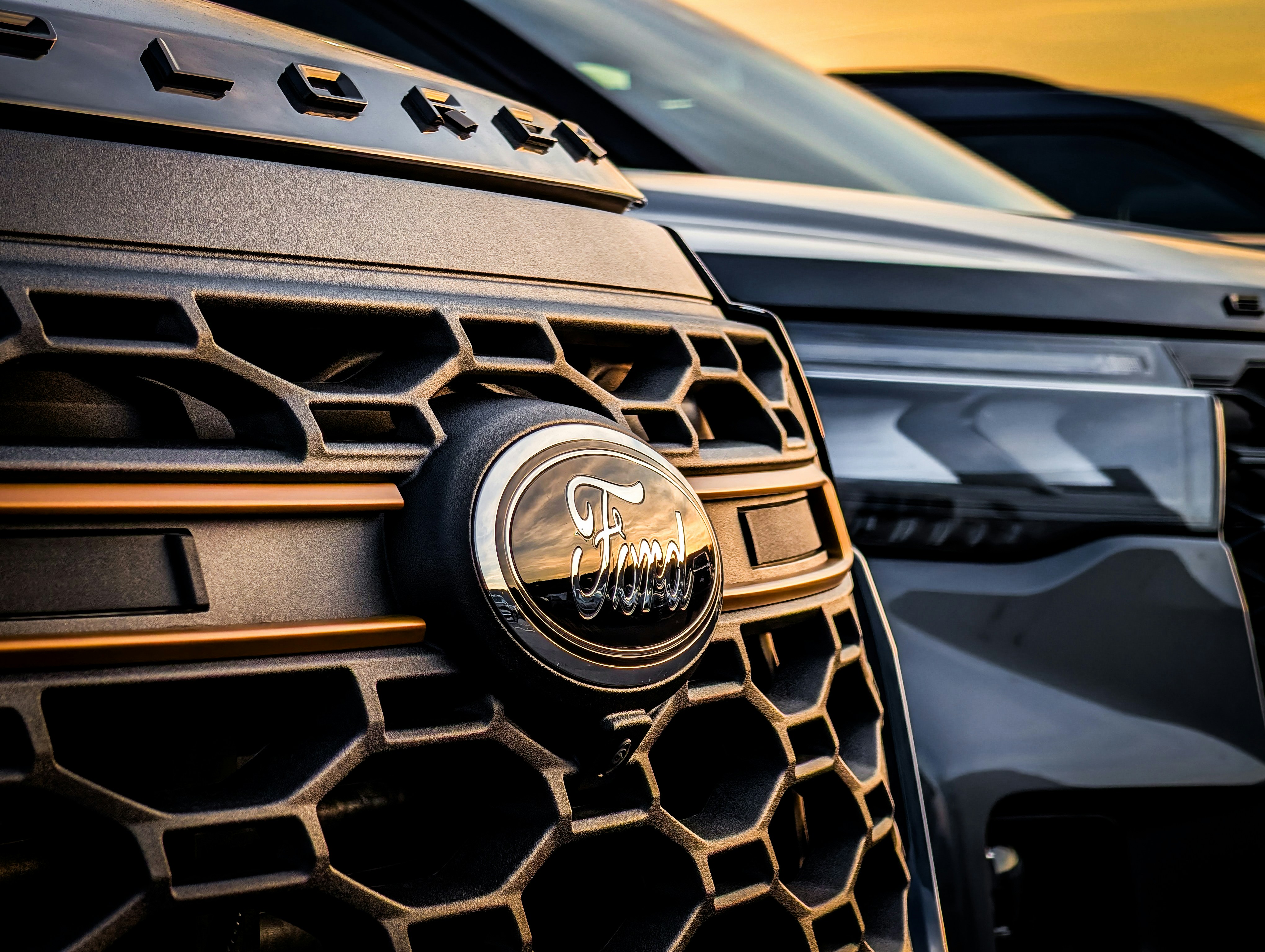 Front Grille Focus: Ford emblem framed by honeycomb mesh on a bold pickup