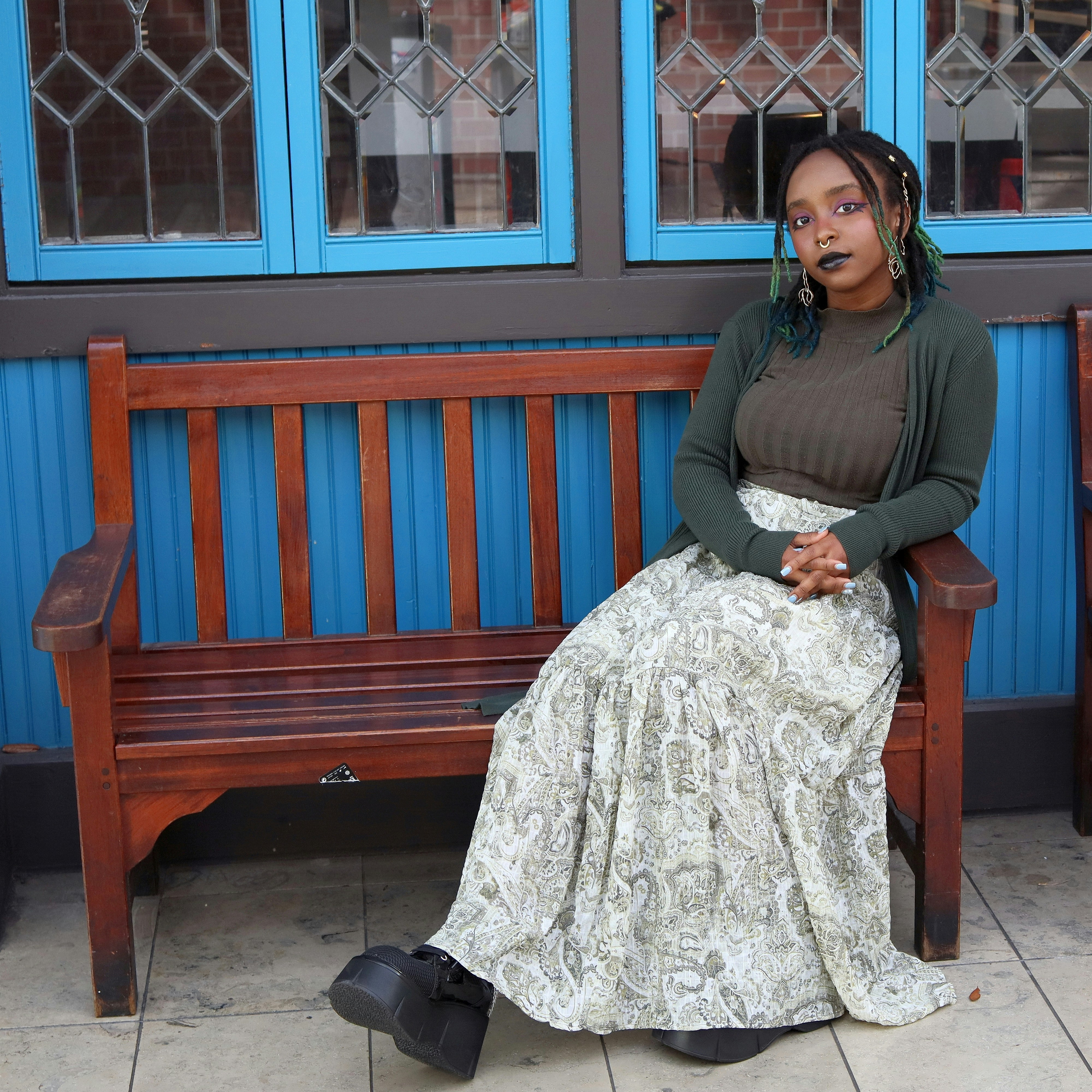 Portrait on a Painted Bench: Quiet Confidence in Indigo Tones