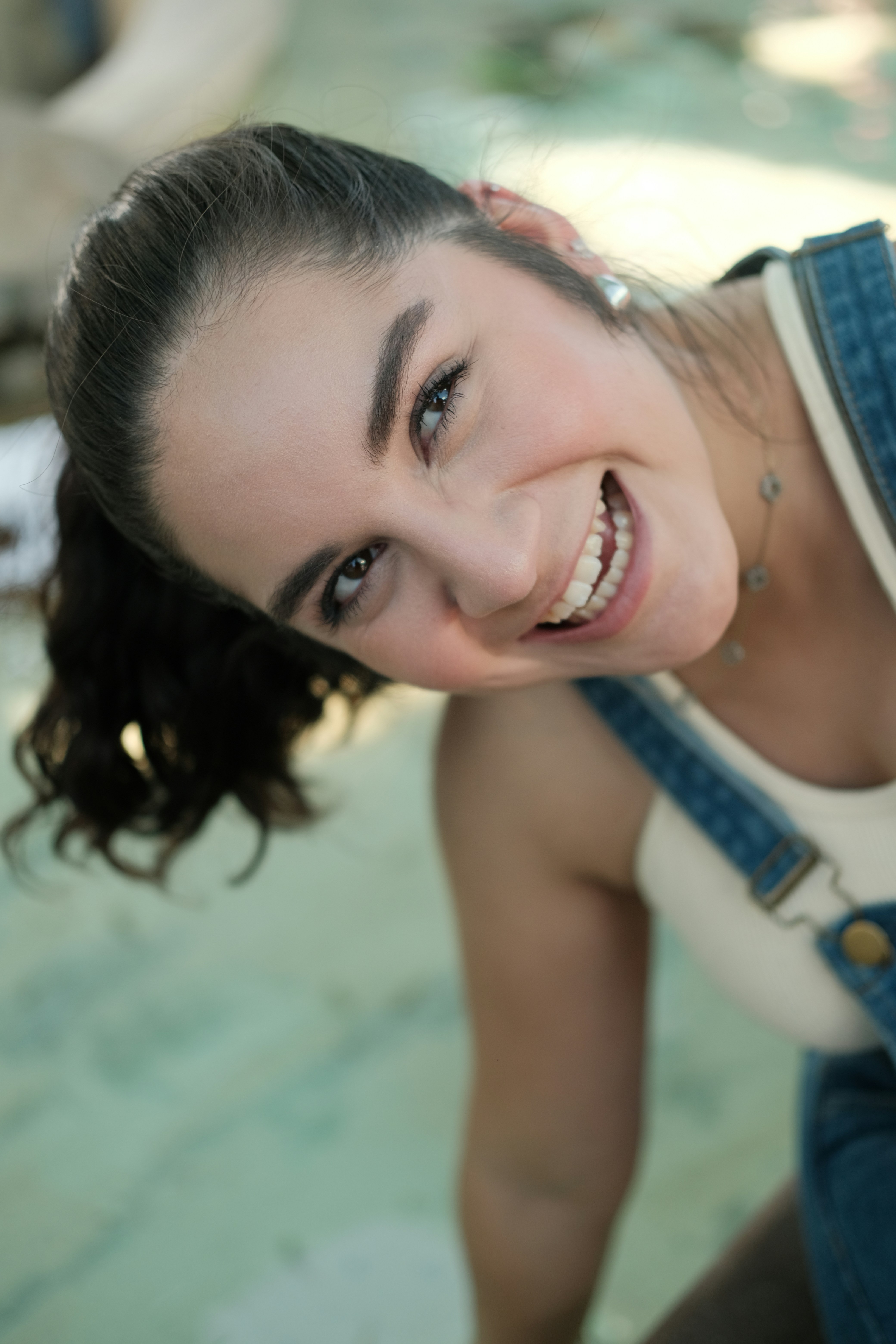 Bright Smile, Sunny Day: A Candid Tilt-Shift of a Joyful Portrait