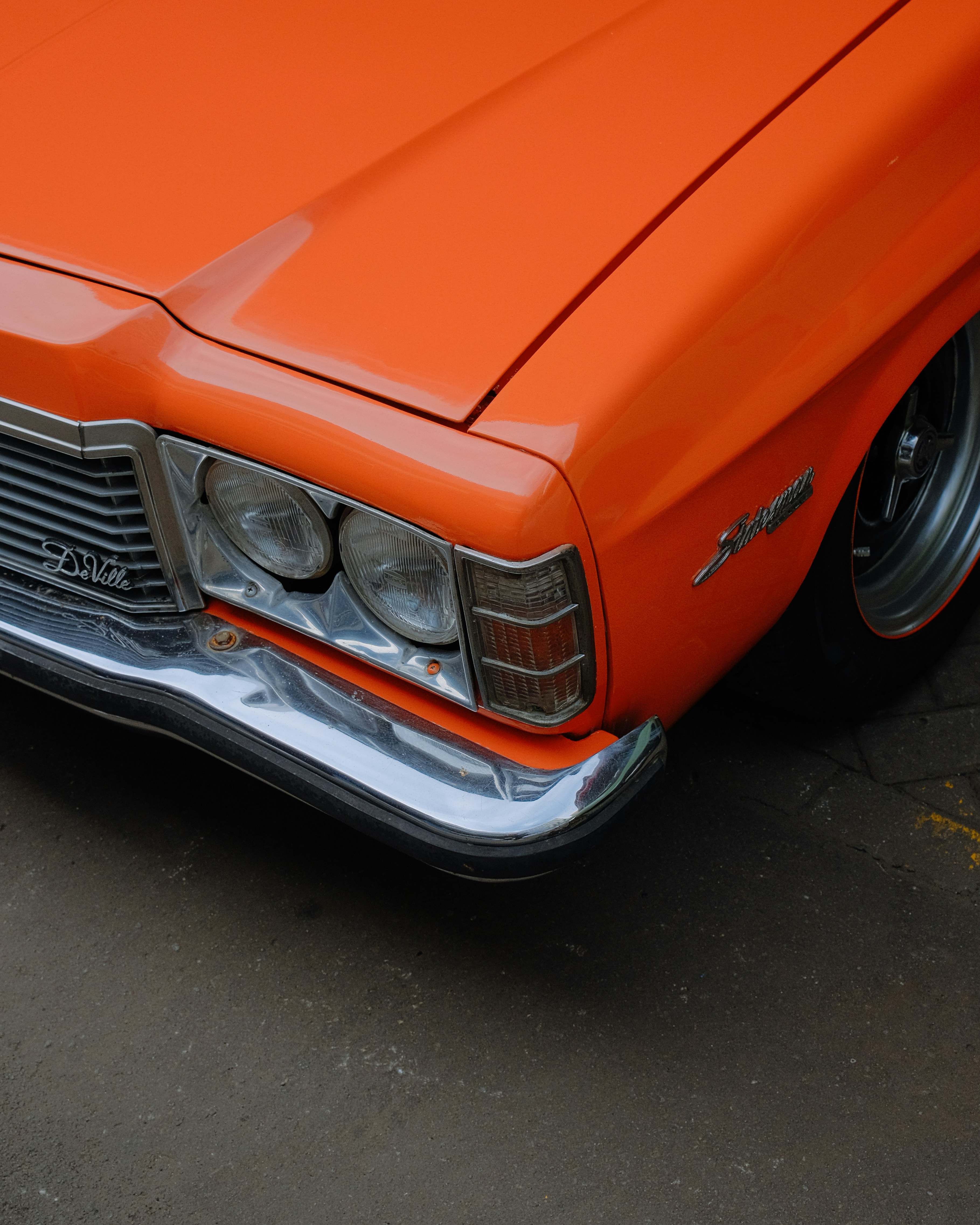 Orange Classic: The Front Quarter of a Draped 1970s Muscle Car