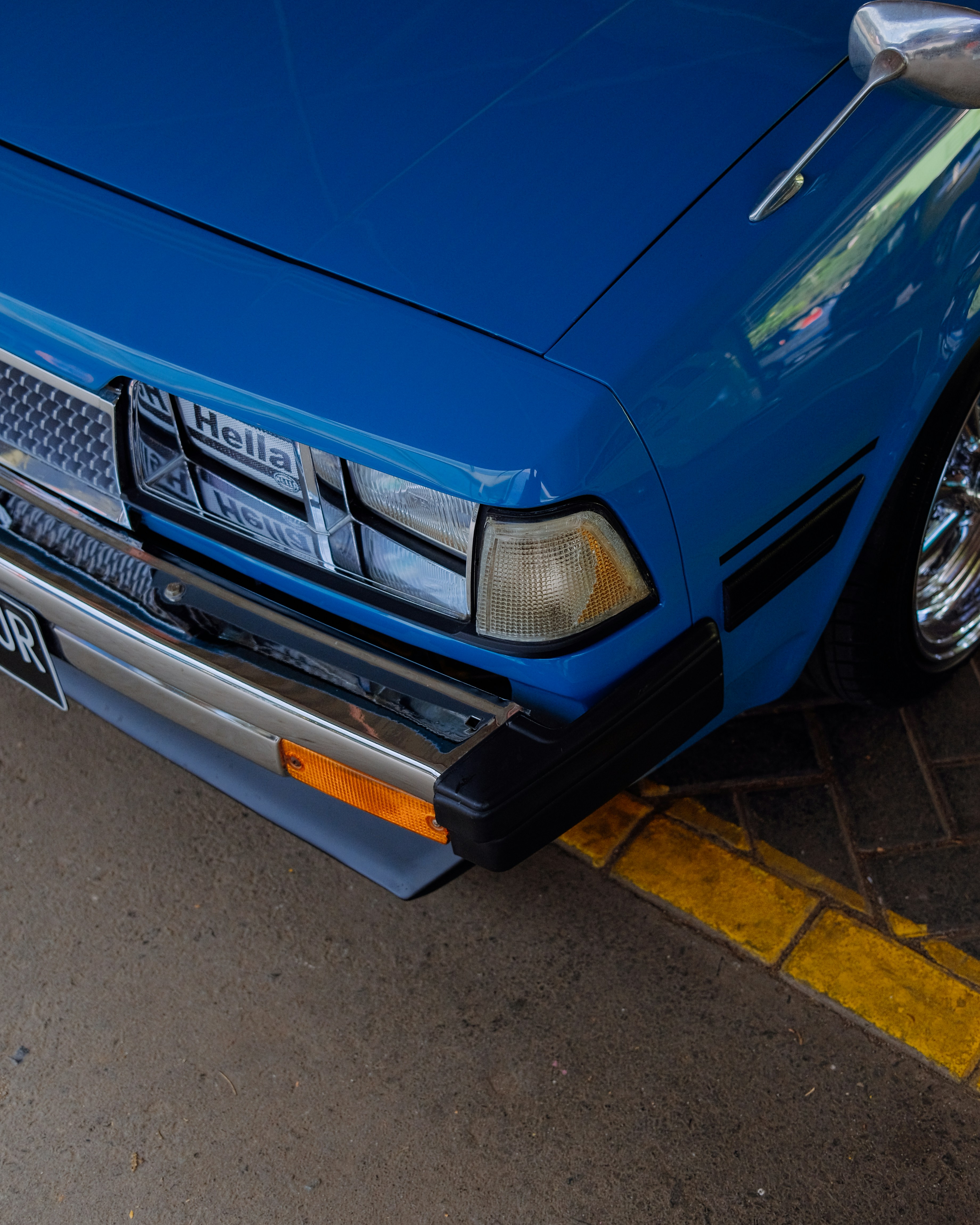 Blue Lean into the Corner: A Classic Car's Front Nose