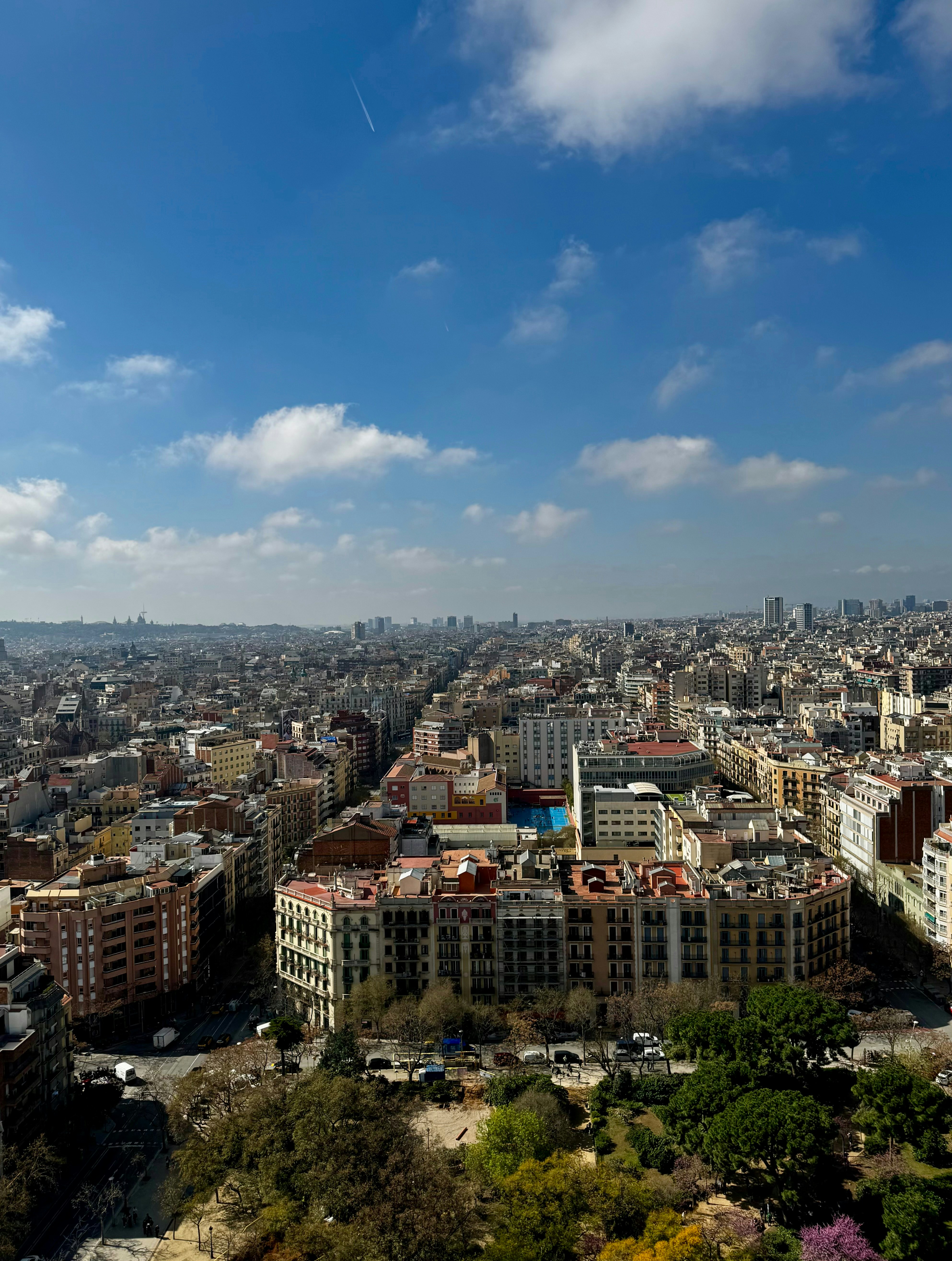 Aerial Tapestry: City Gridded Under a Wide Blue Sky