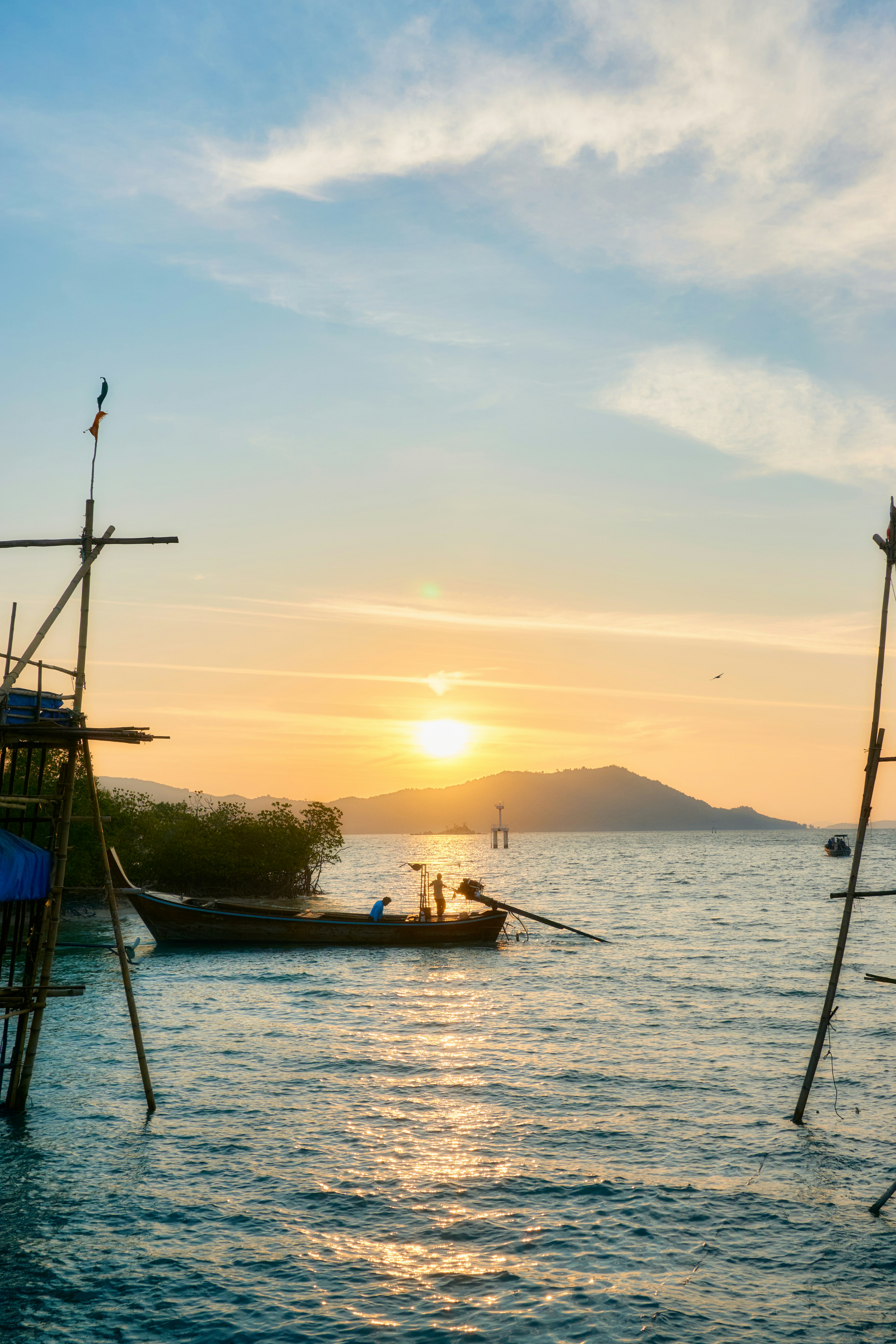 Sunset at Sea with a Silhouette of a Fishing Boat