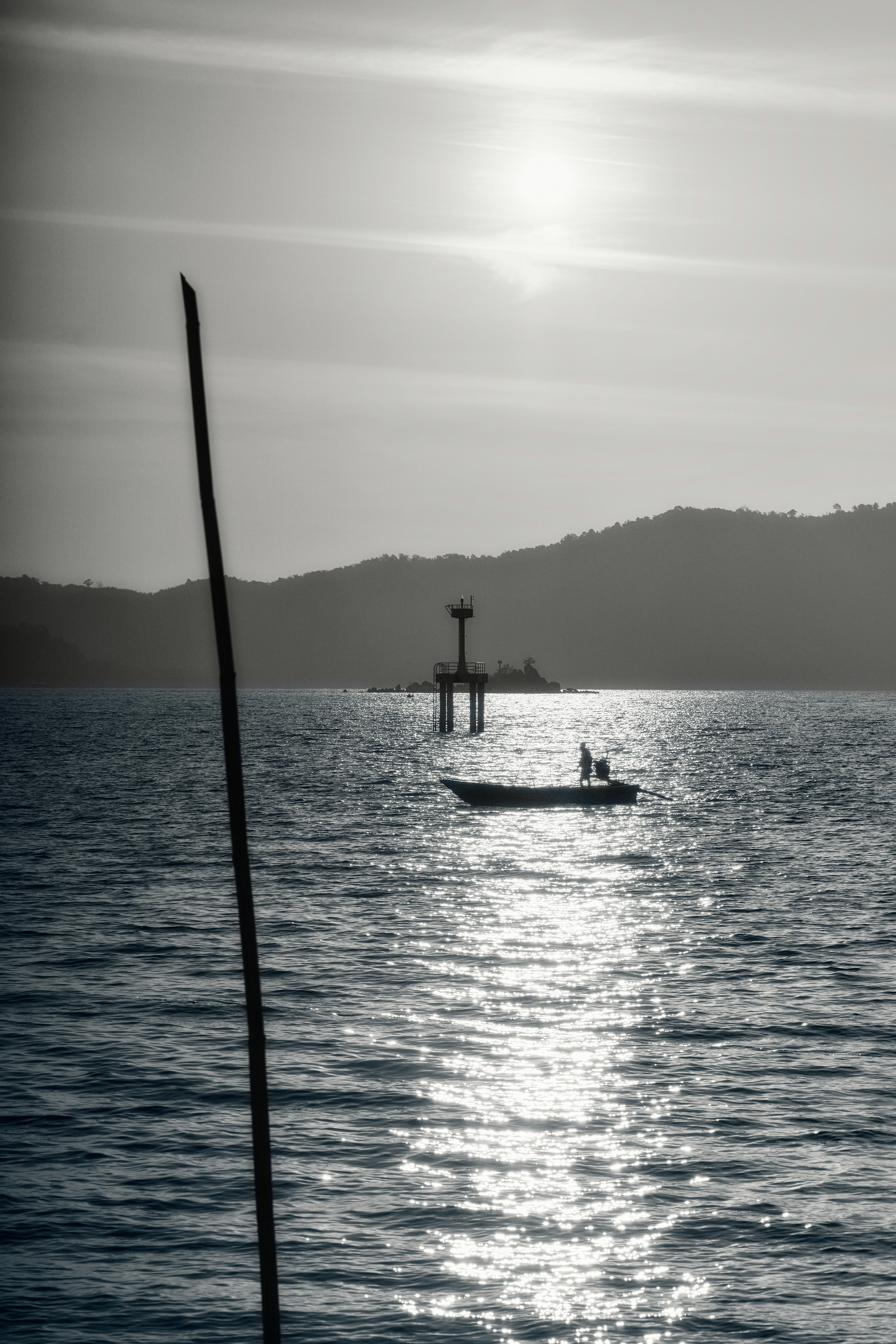 Glittering Path: A Small Boat Against a Distant Horizon