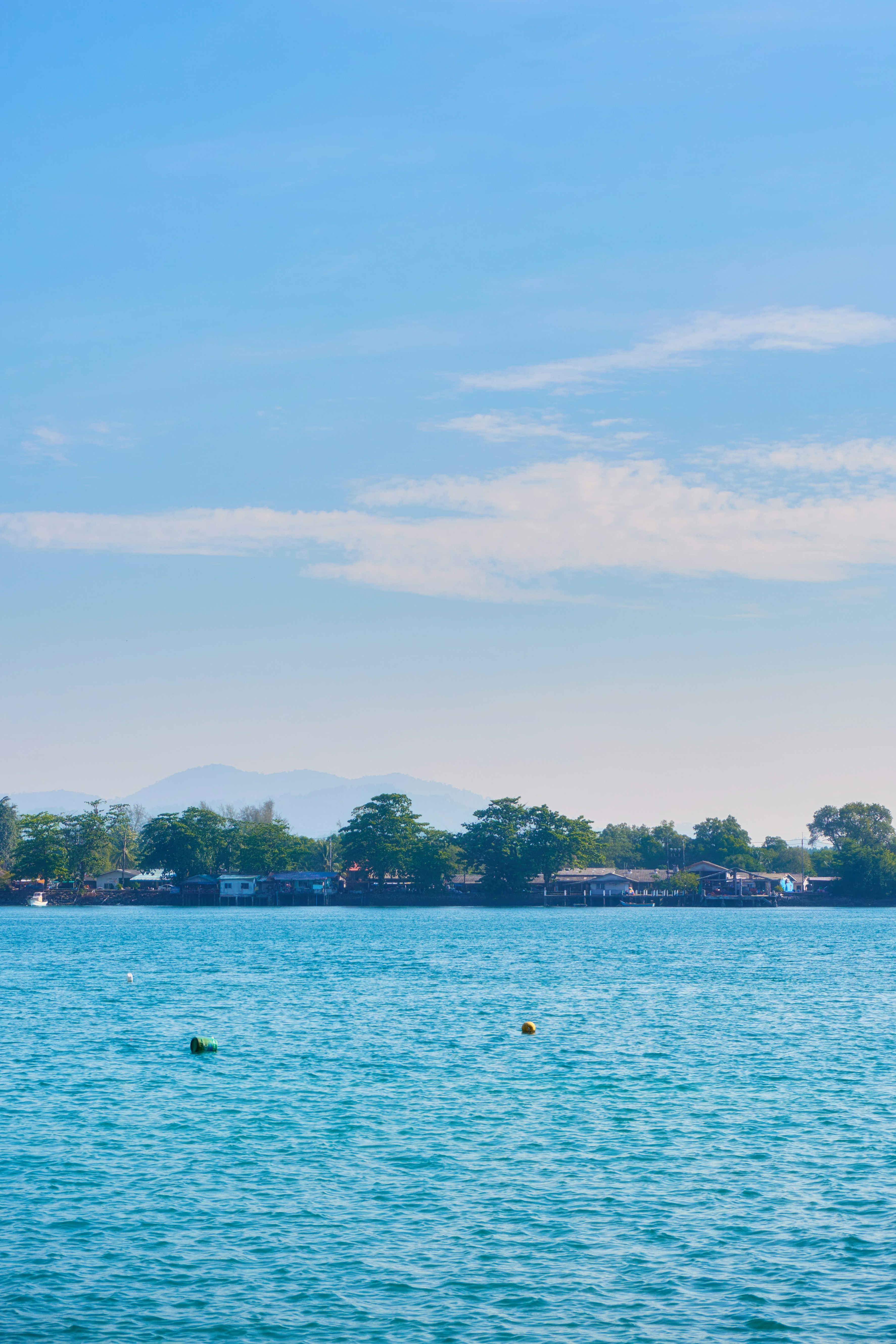Quiet Lakefront Under a Wide Blue Sky