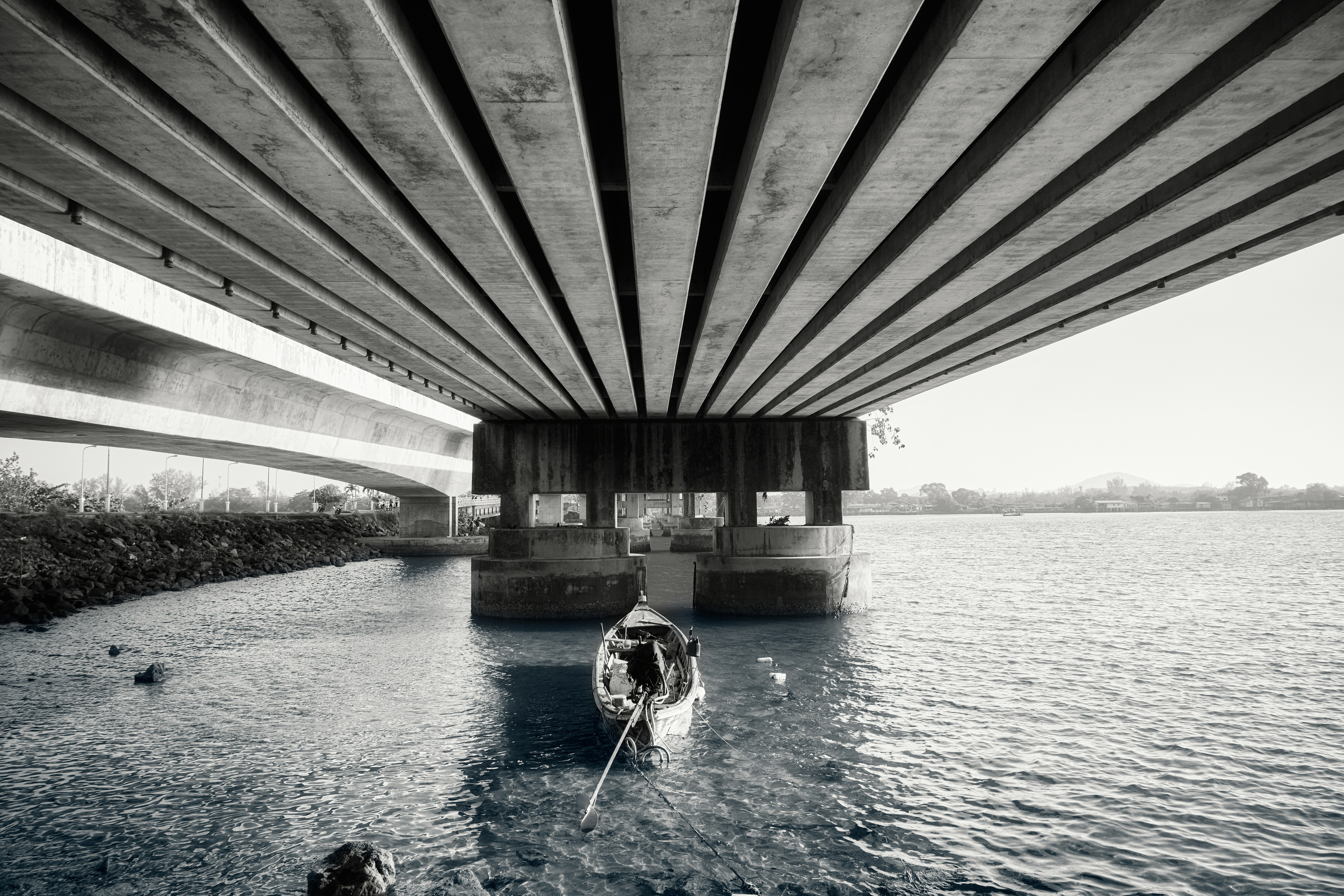 Under the Span: Boat and Bridge Converge at Waterline