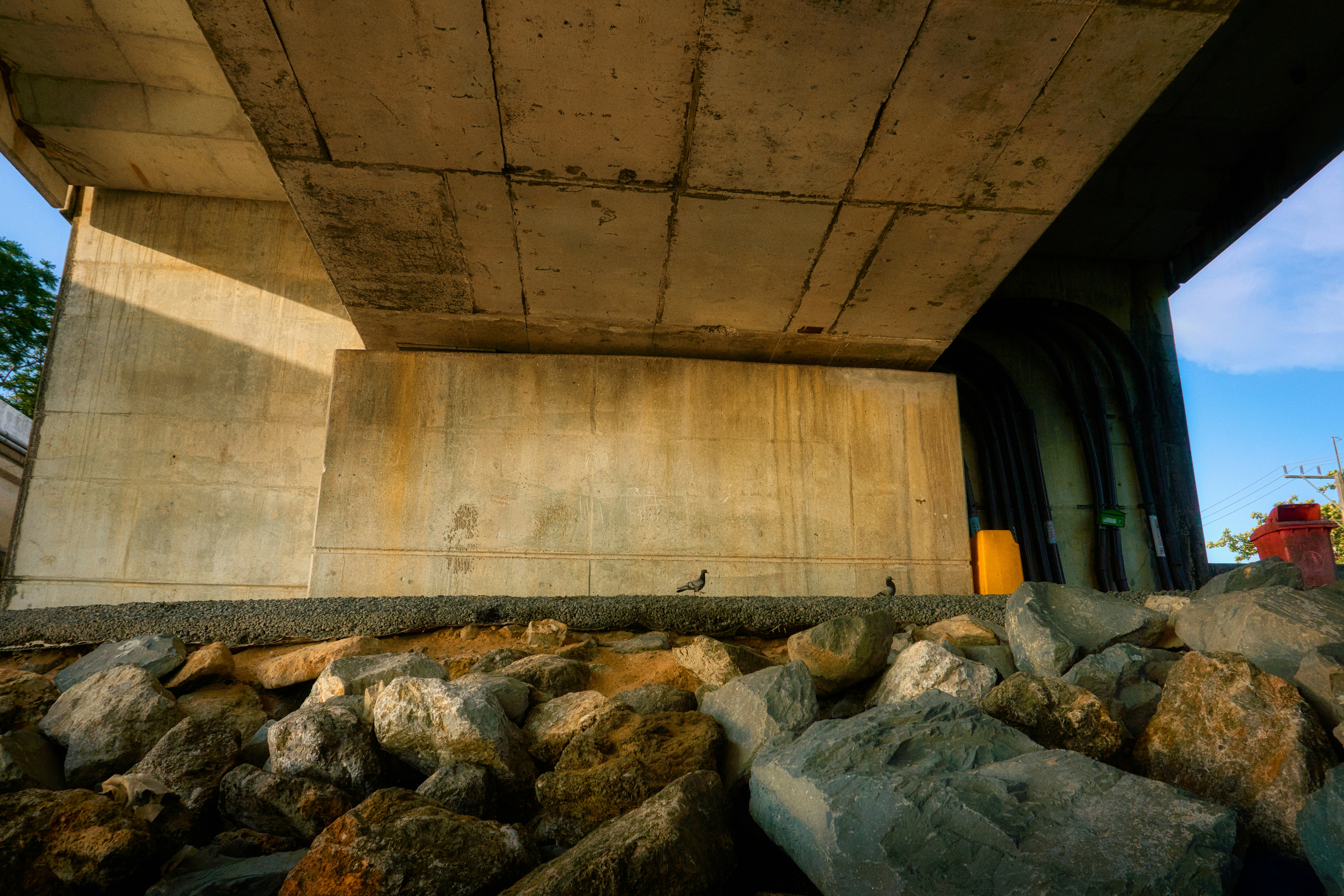 Concrete Underpass Above a Shaded Rock Streak