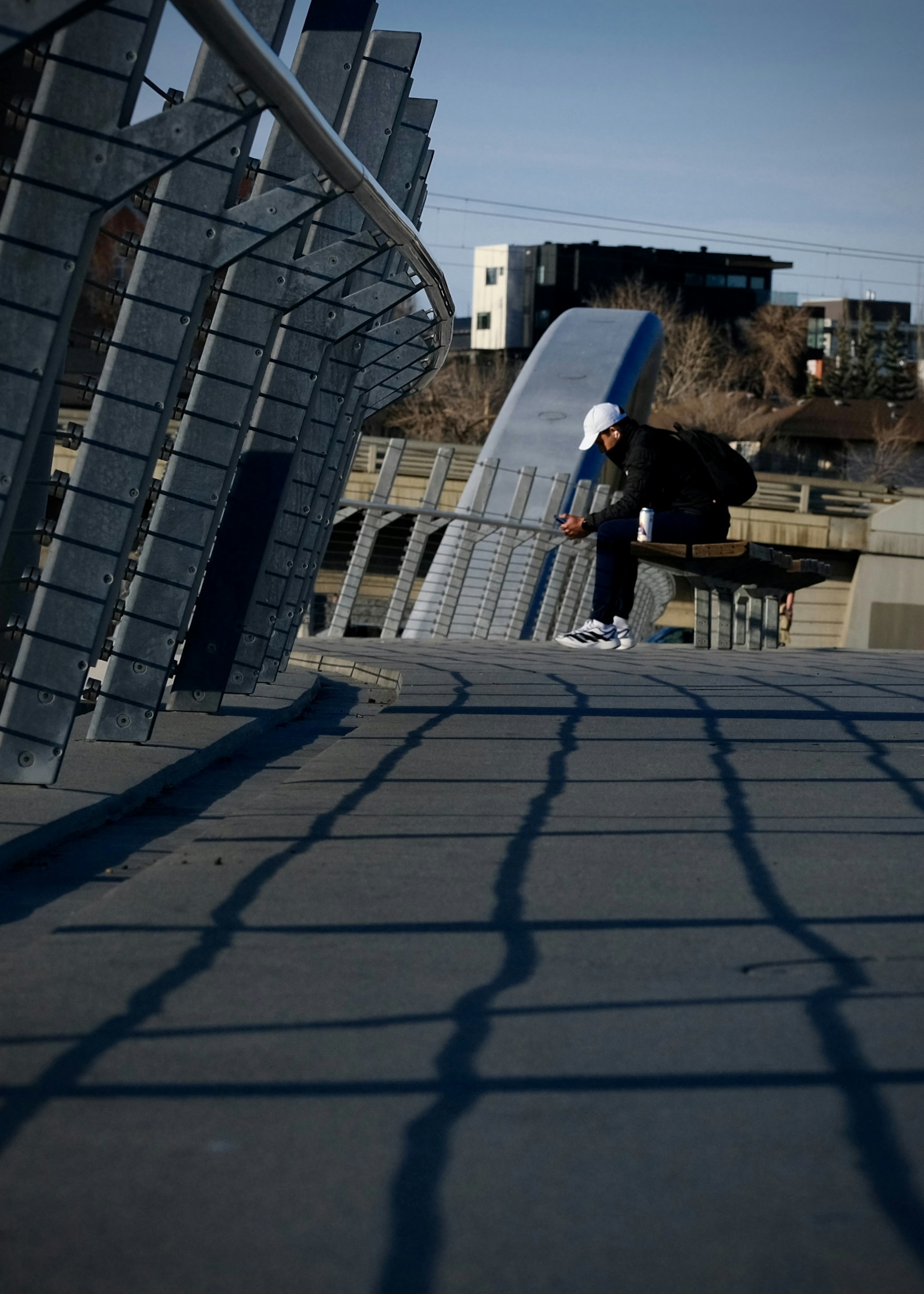 Benchside Focus: A Seated Moment on a Geometric Walkway