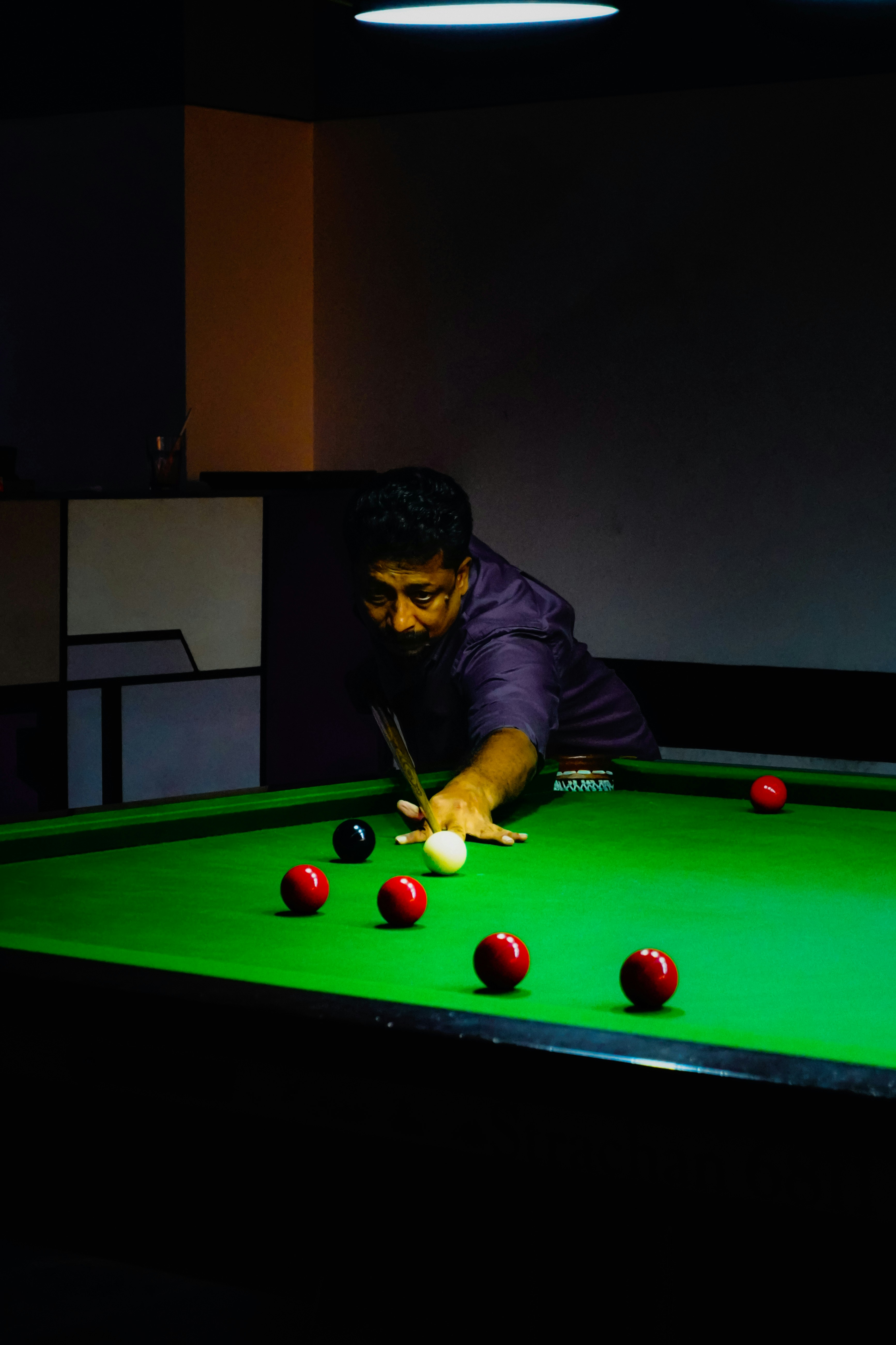 The Quiet Focus: A Billiard Master in Midnight Green