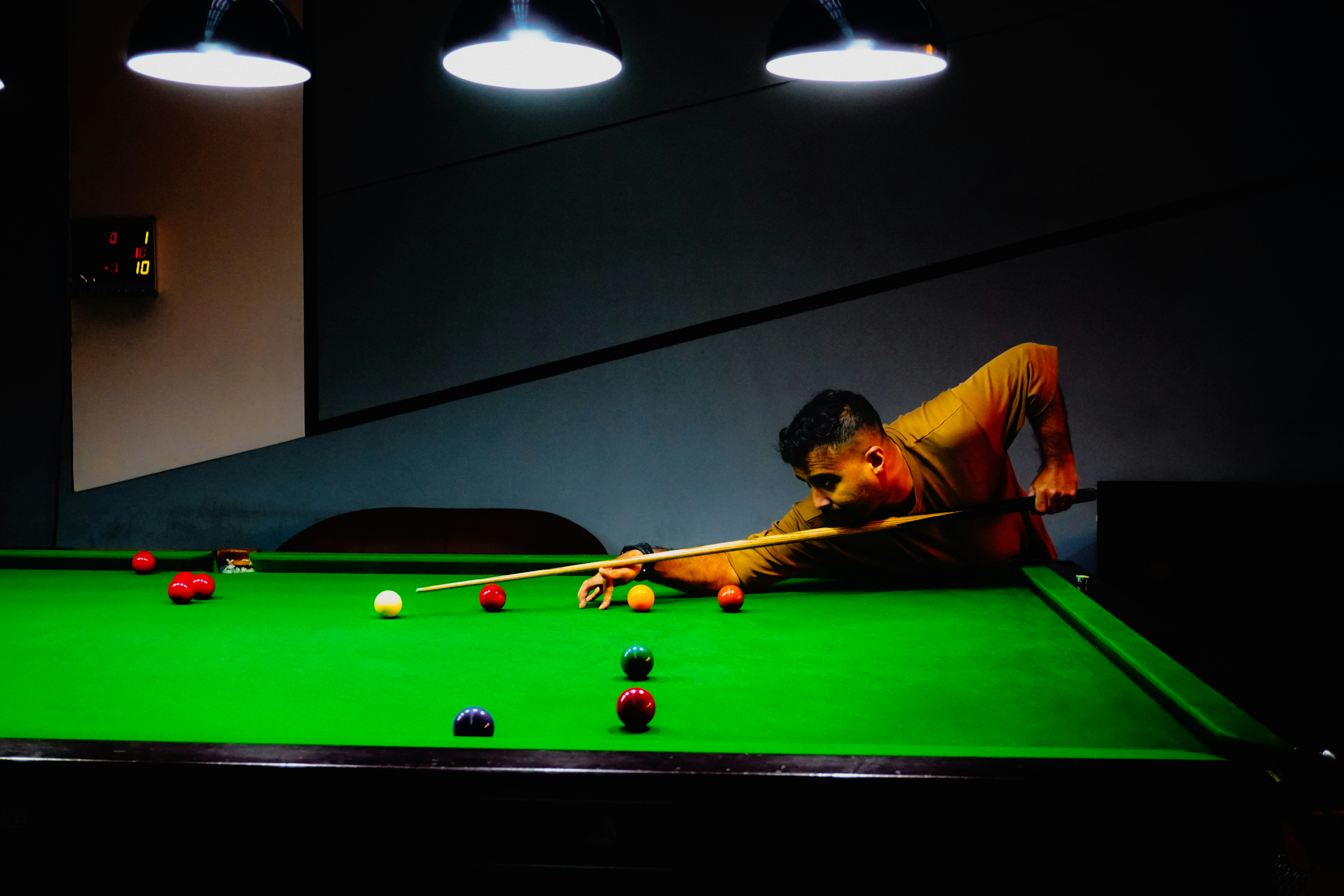 Slide, Spin, and Silence: A Cue Player in a Dim Green Studio