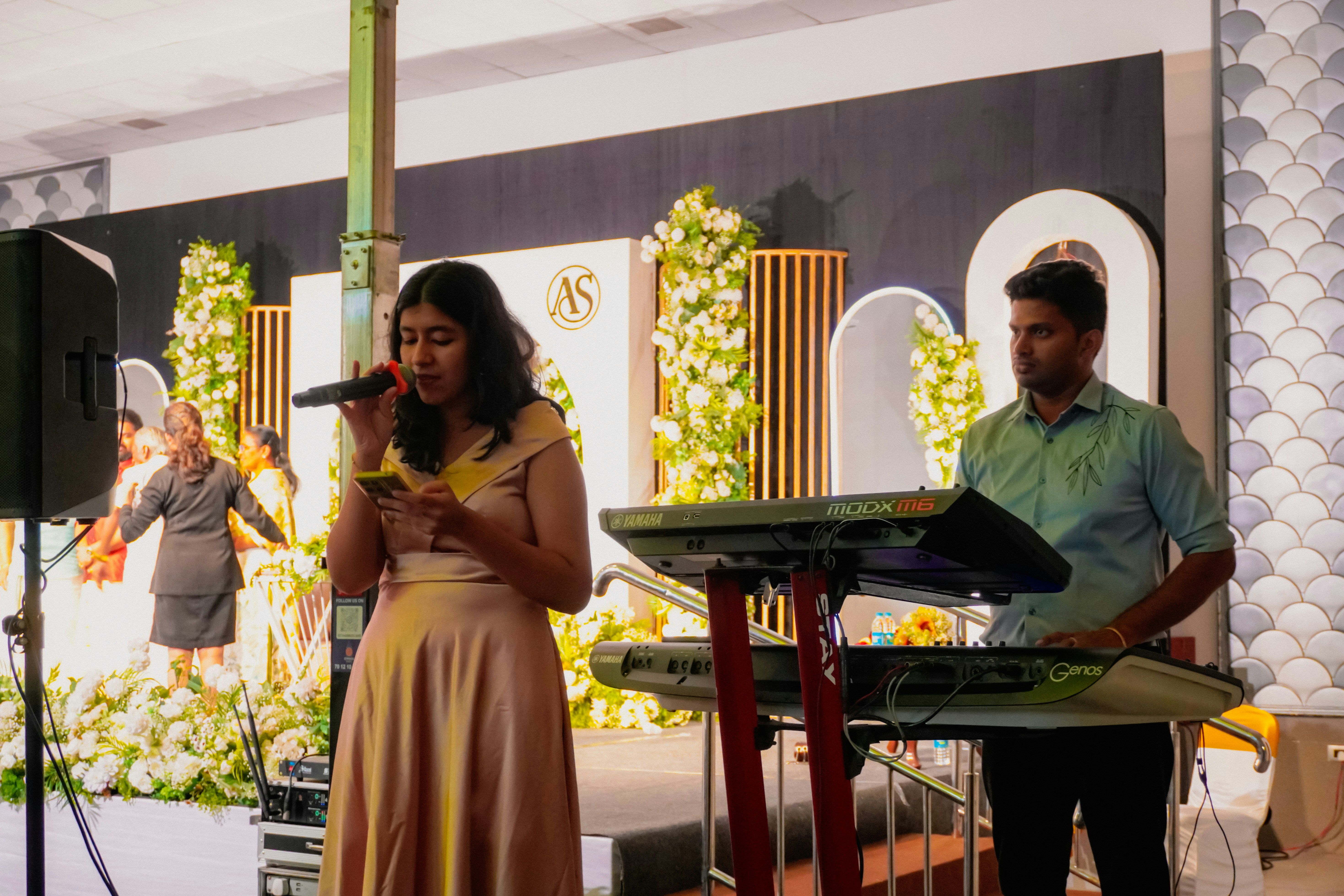 Spotlight Duet: A Vocalist and Keyboardist Understage Bloom