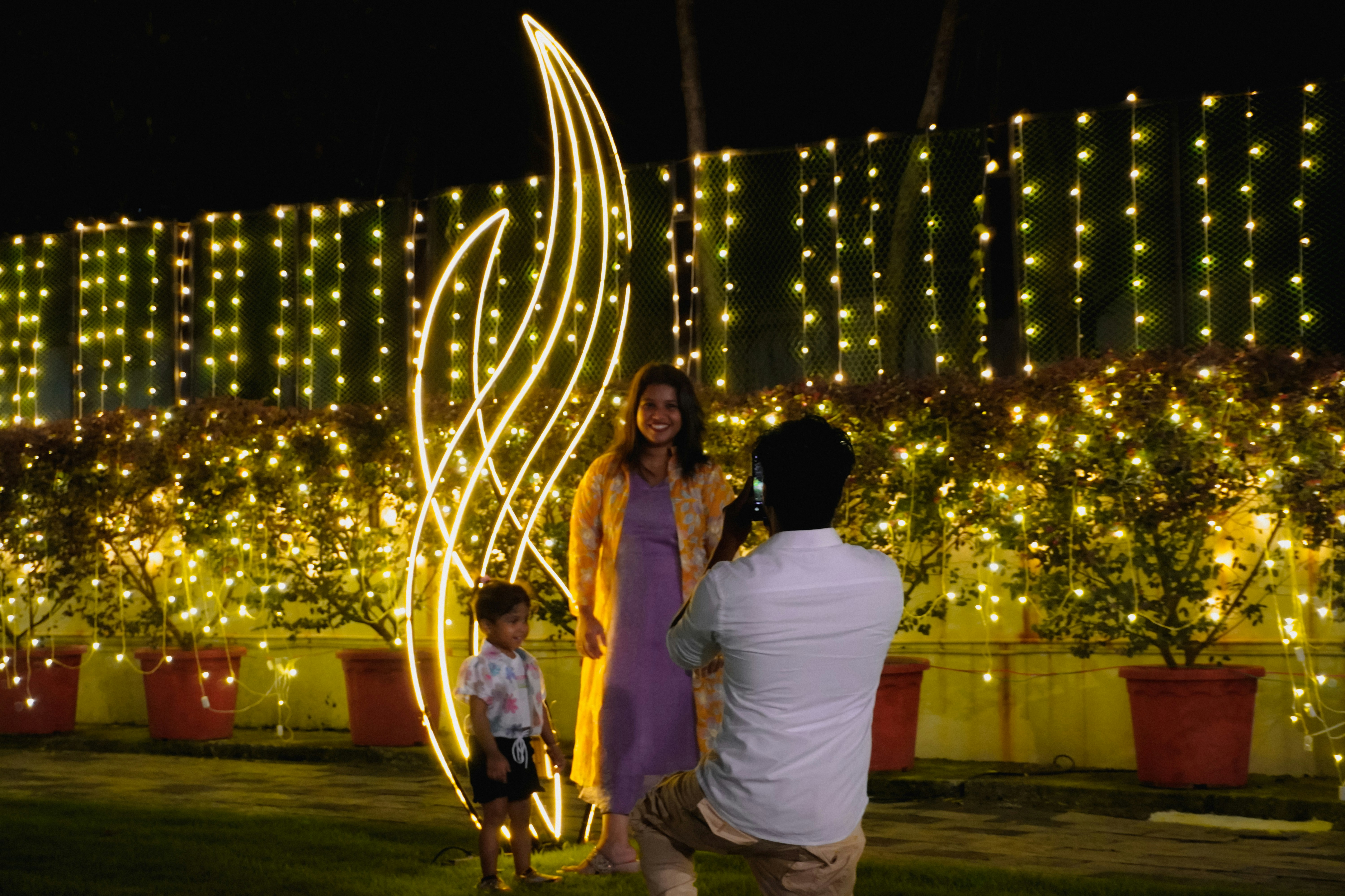 Night Lights and A Moment: Family Portrait by the Glowing Sculpture