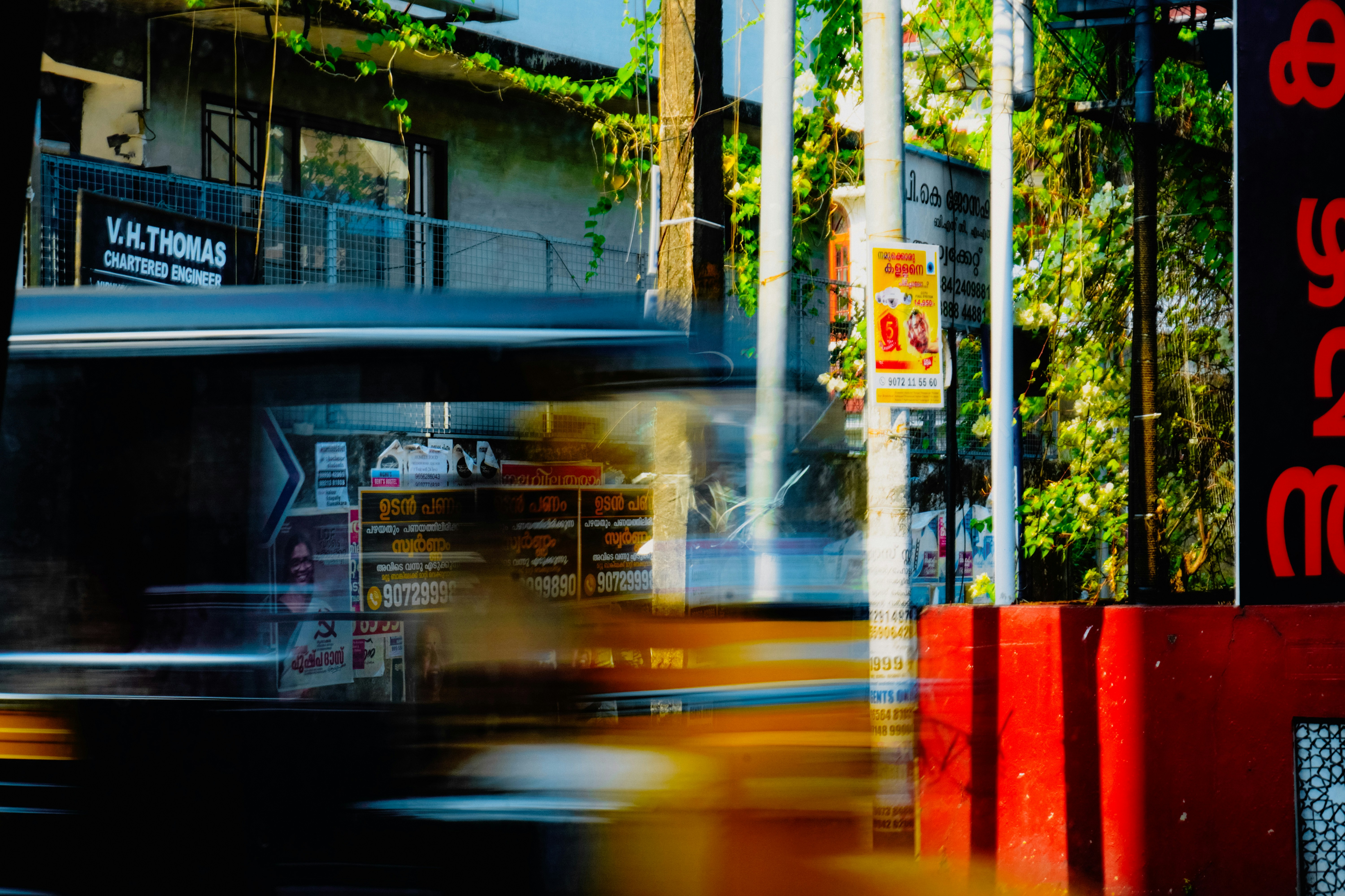 Blurry Taxi Passages: Neon Street Blur by the Bus Stop