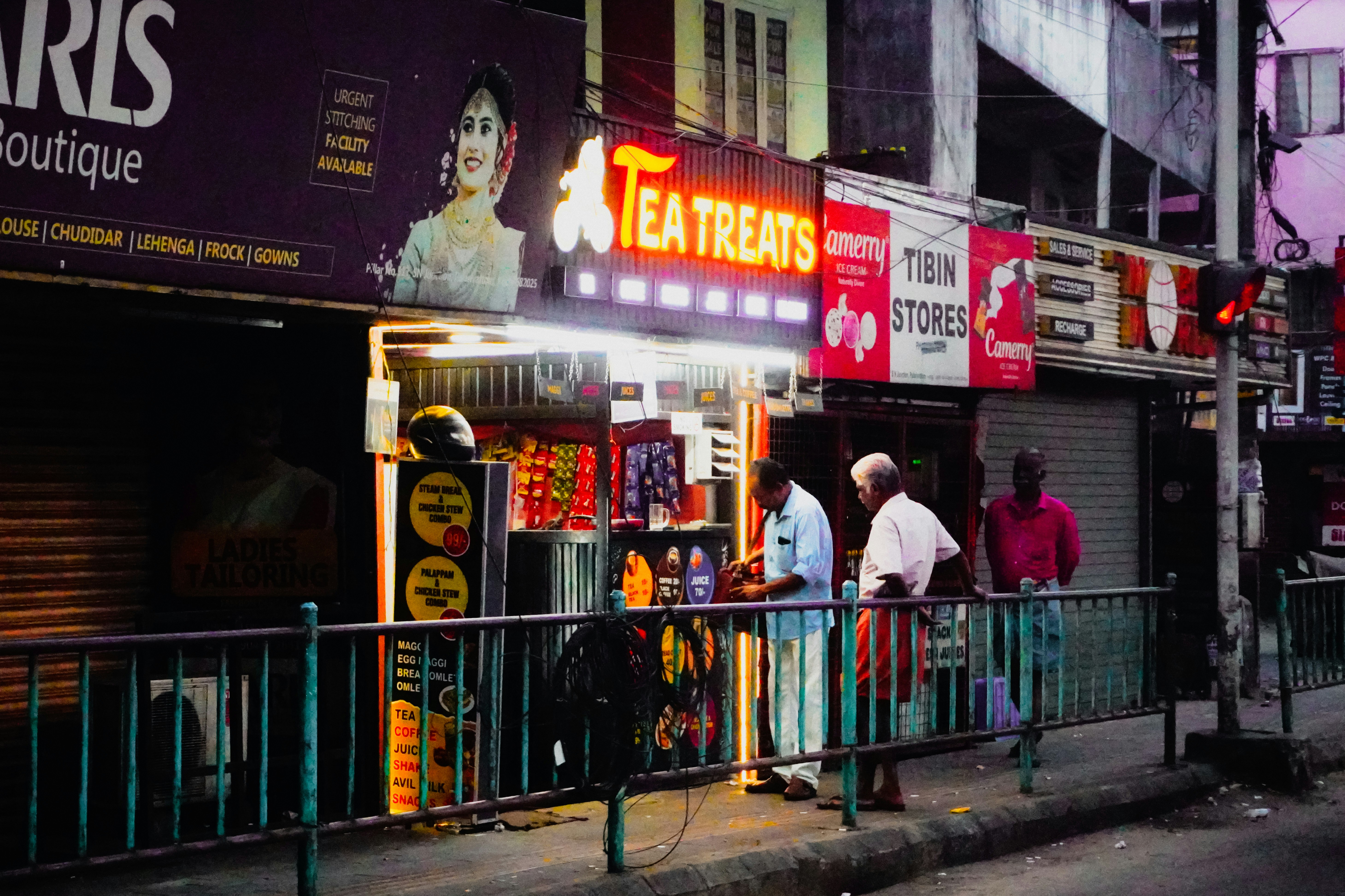 Neon Tea Stop on a Busy Street