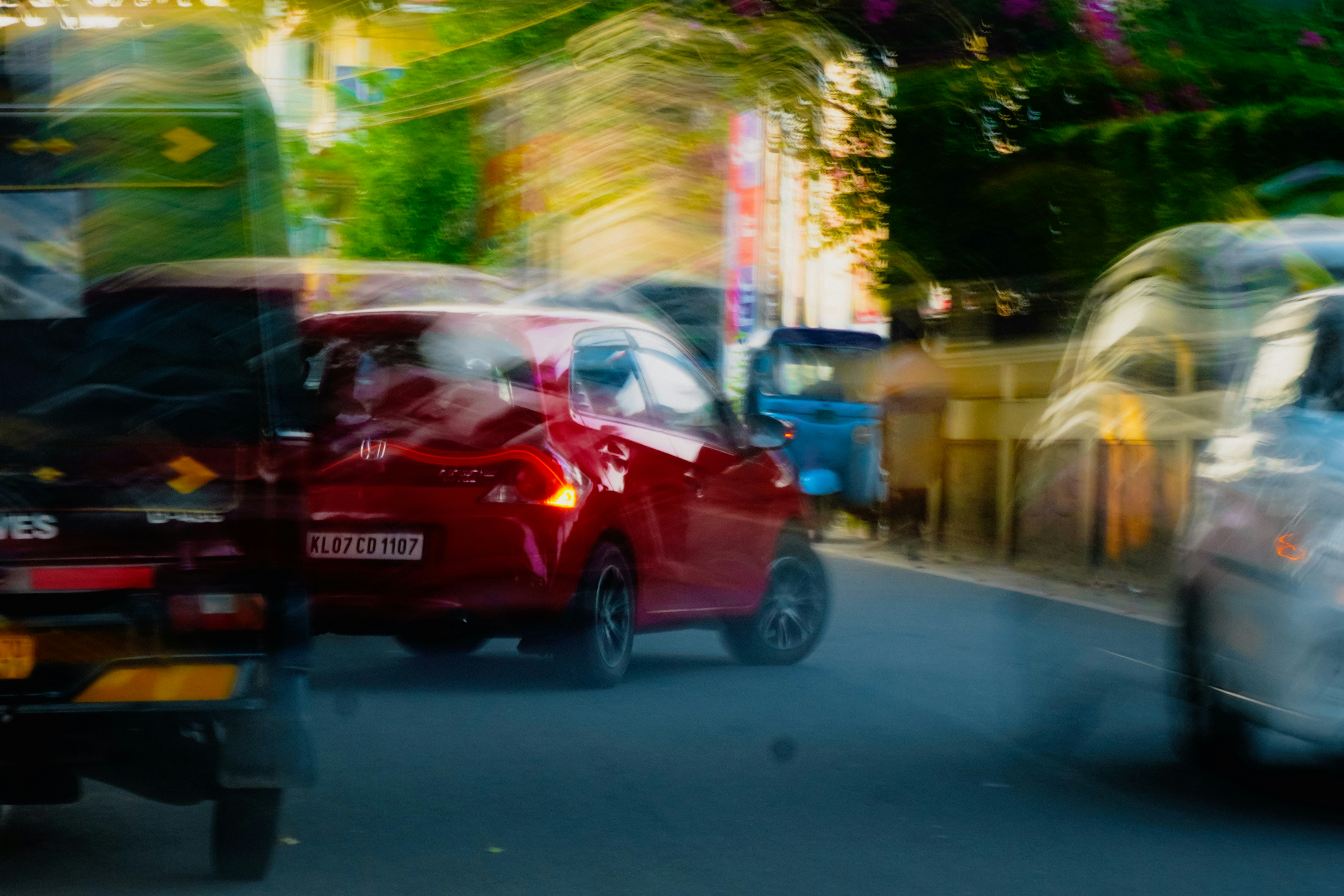 Blurring Motion, Red Car in Morning Traffic