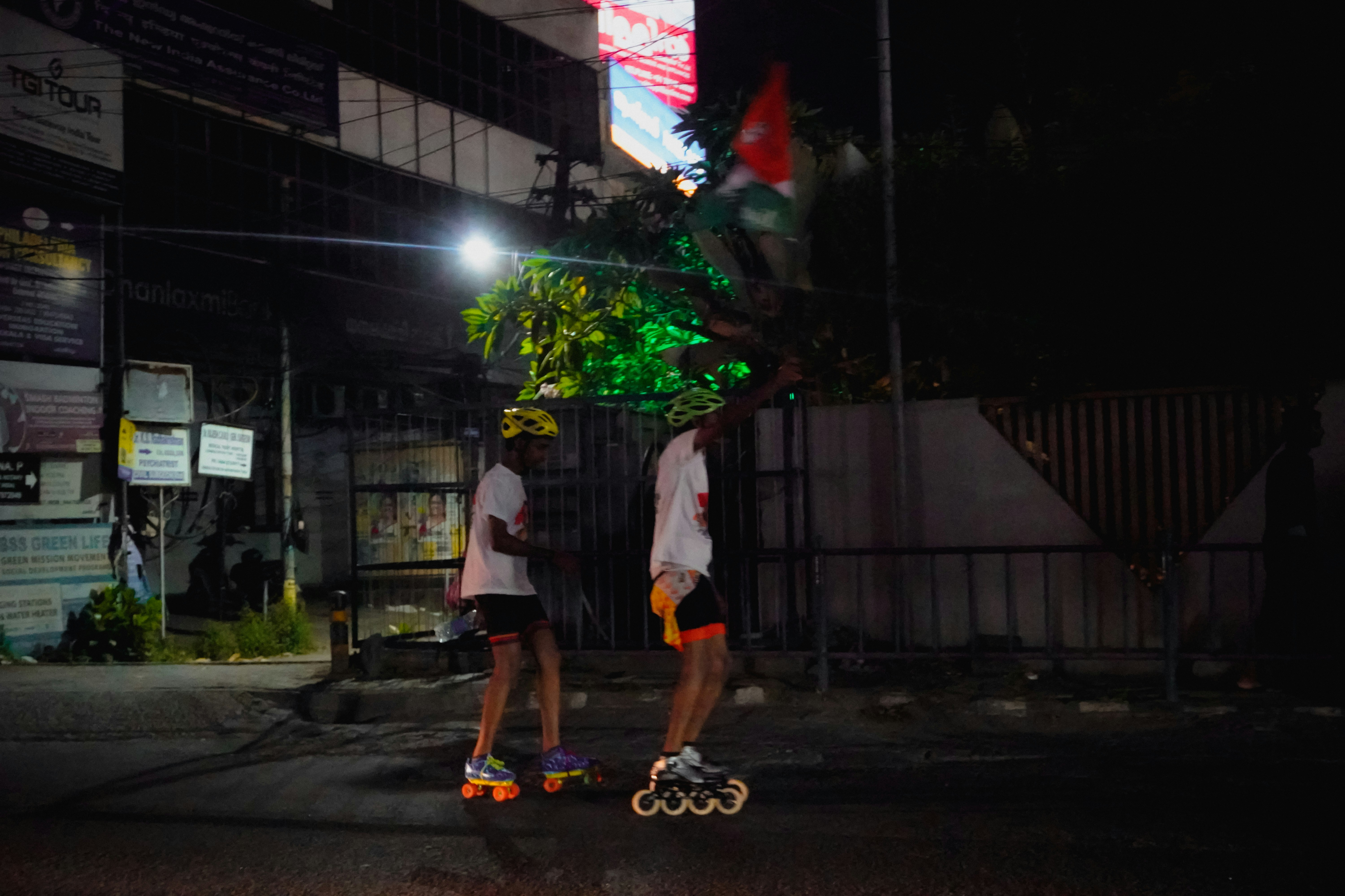 Midnight Skate: Dual Roller Ambassadors Under Neon Night