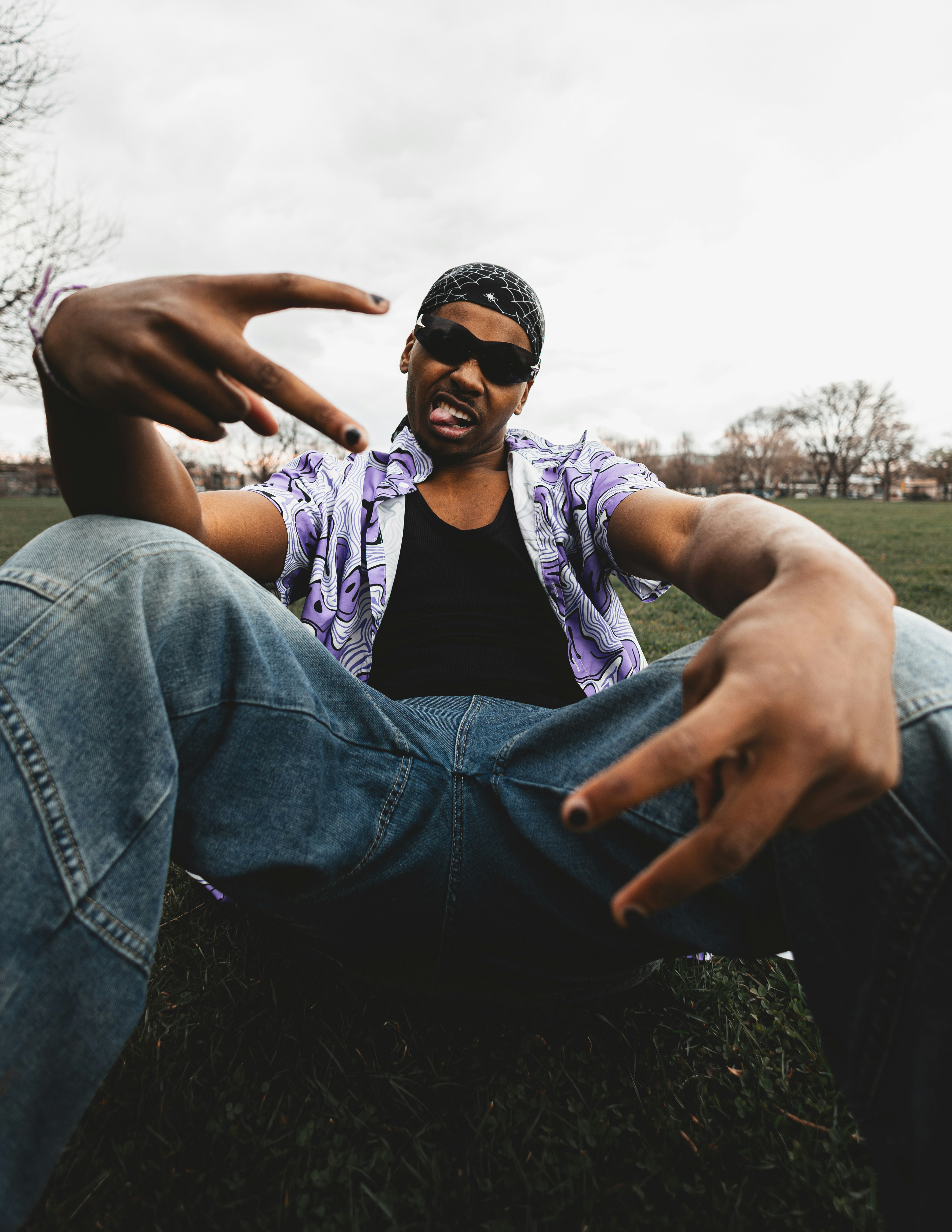 Low-angle Portrait in a Park: Hands, Smile, and Vibe