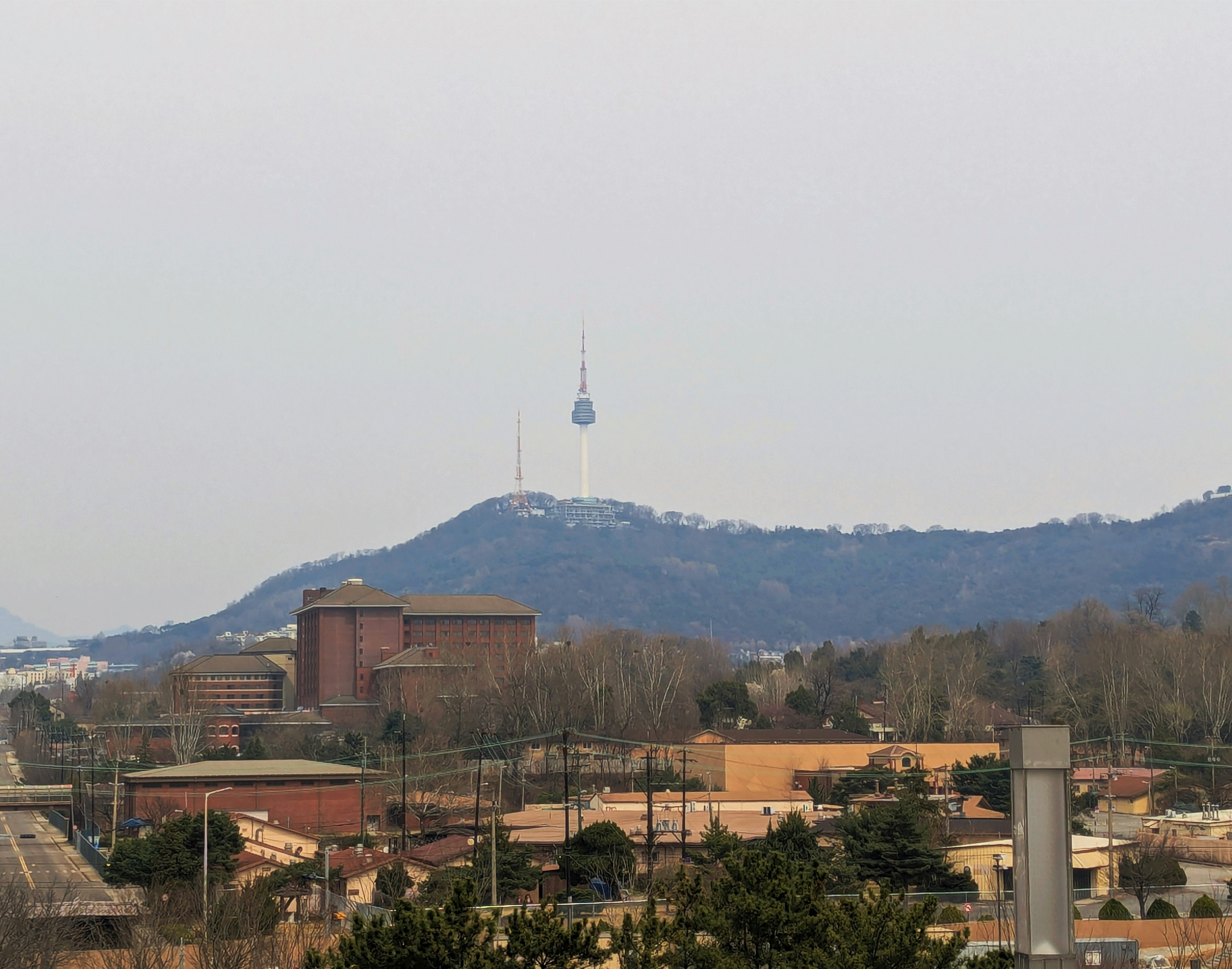 Cityscape Rampart: A Towered Skyline Presses Against the Hills