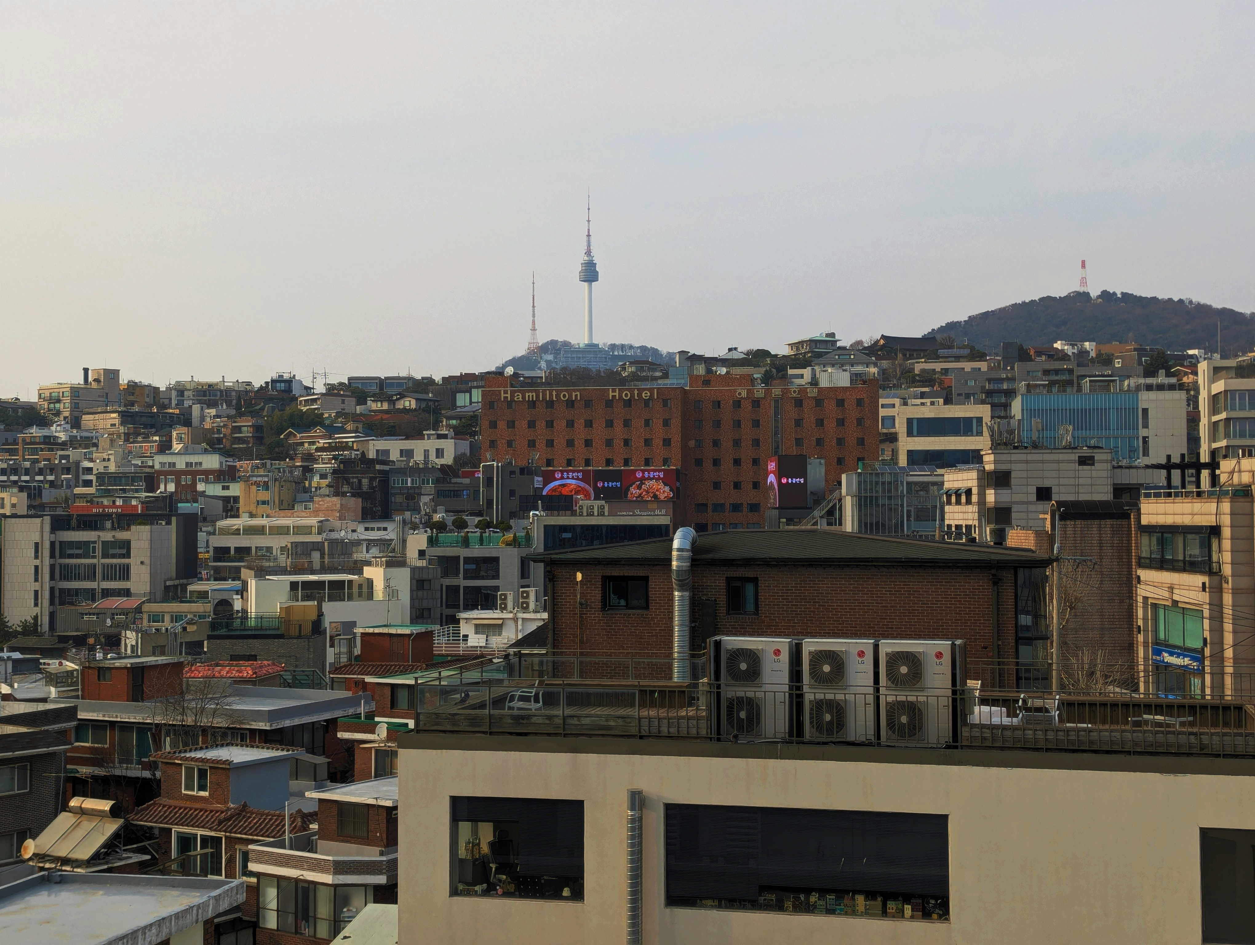 Urban Horizon: The Cityscape with a Distant Broadcast Tower