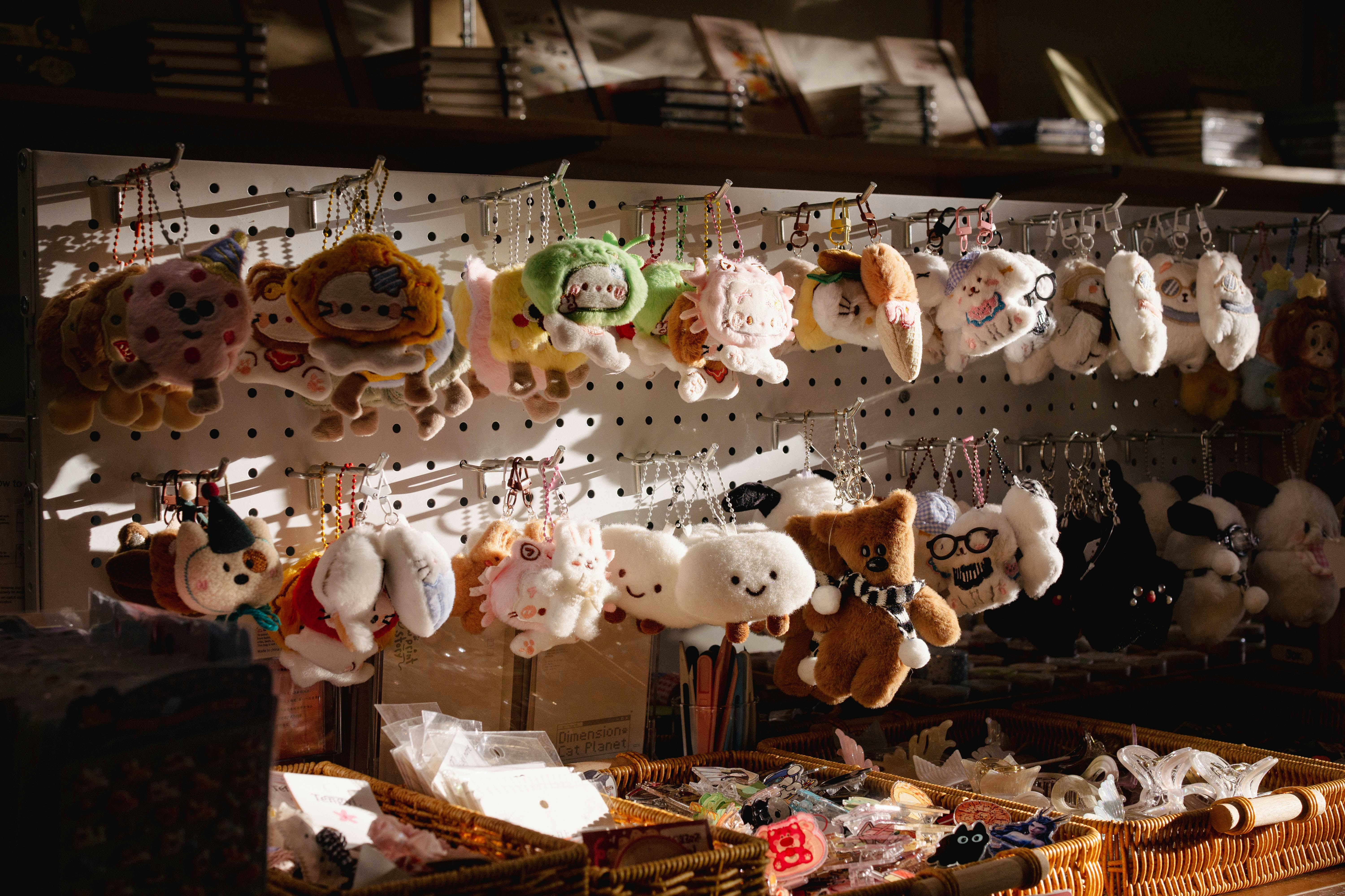 Toy Lane: A Row of Plush Charms Under Warm Market Lights