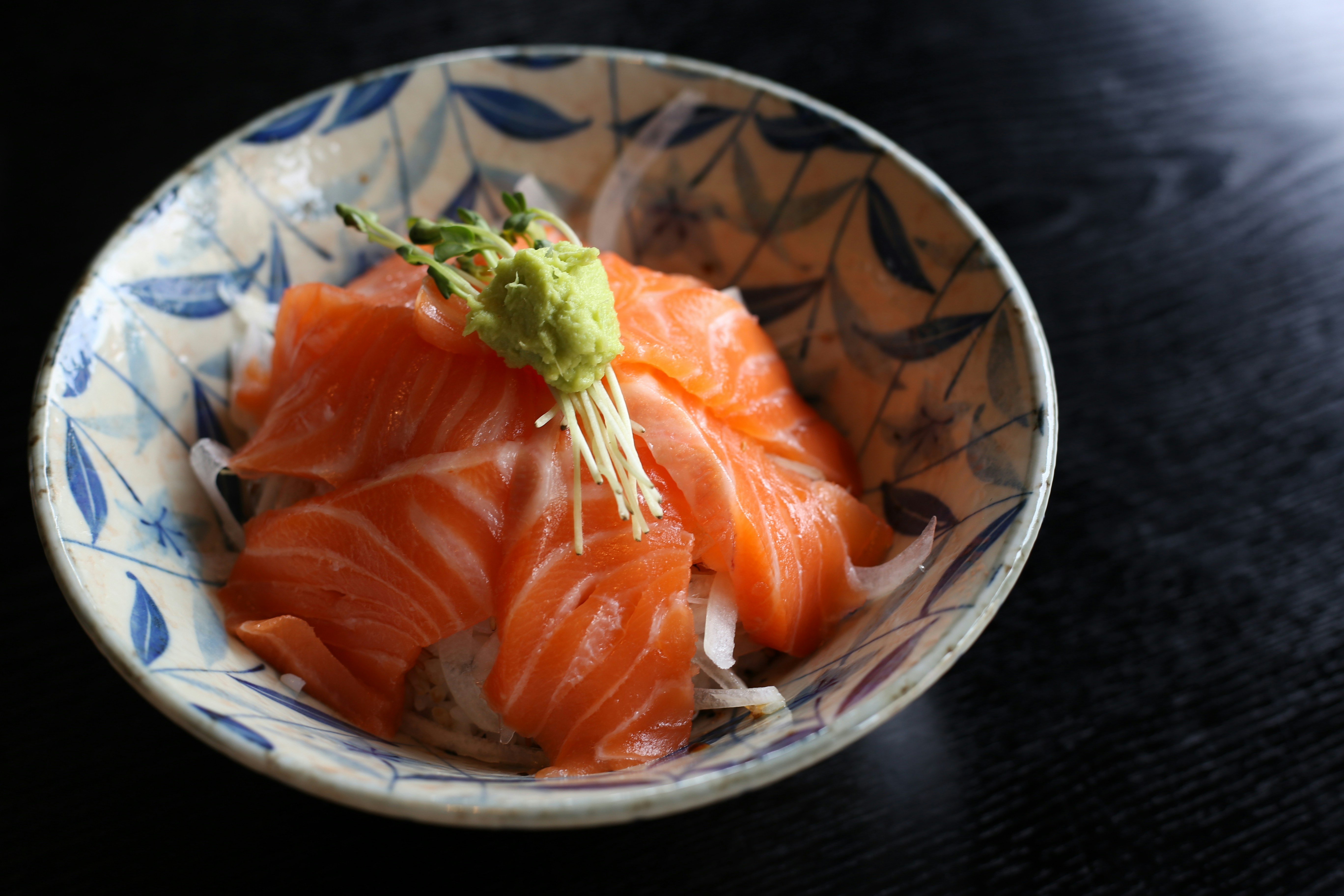 Citrus blush and emerald atop a salmon nest