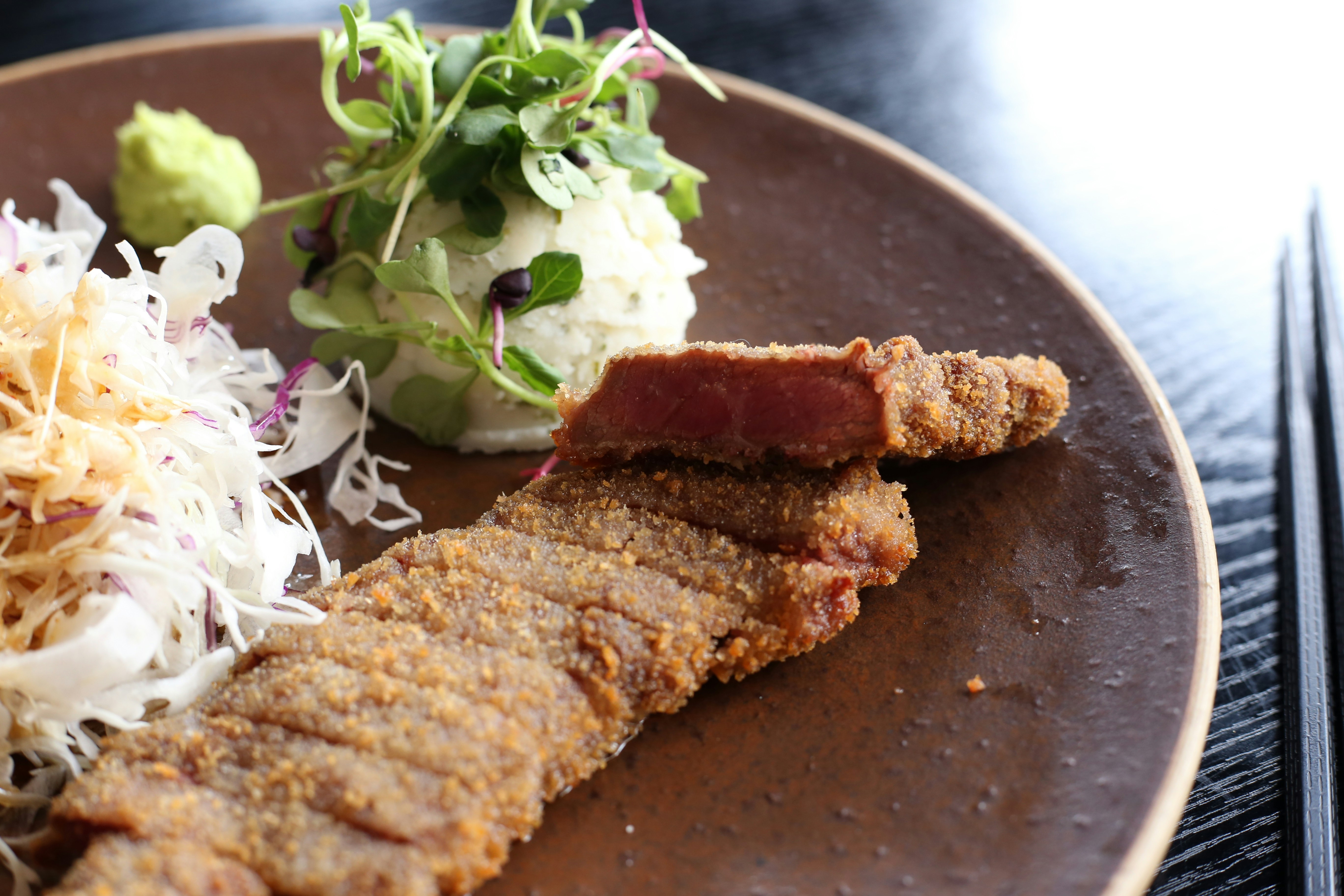 Crisped Teriyaki Mono-Fillet with Shredded Cabbage and Wasabi Bloom
