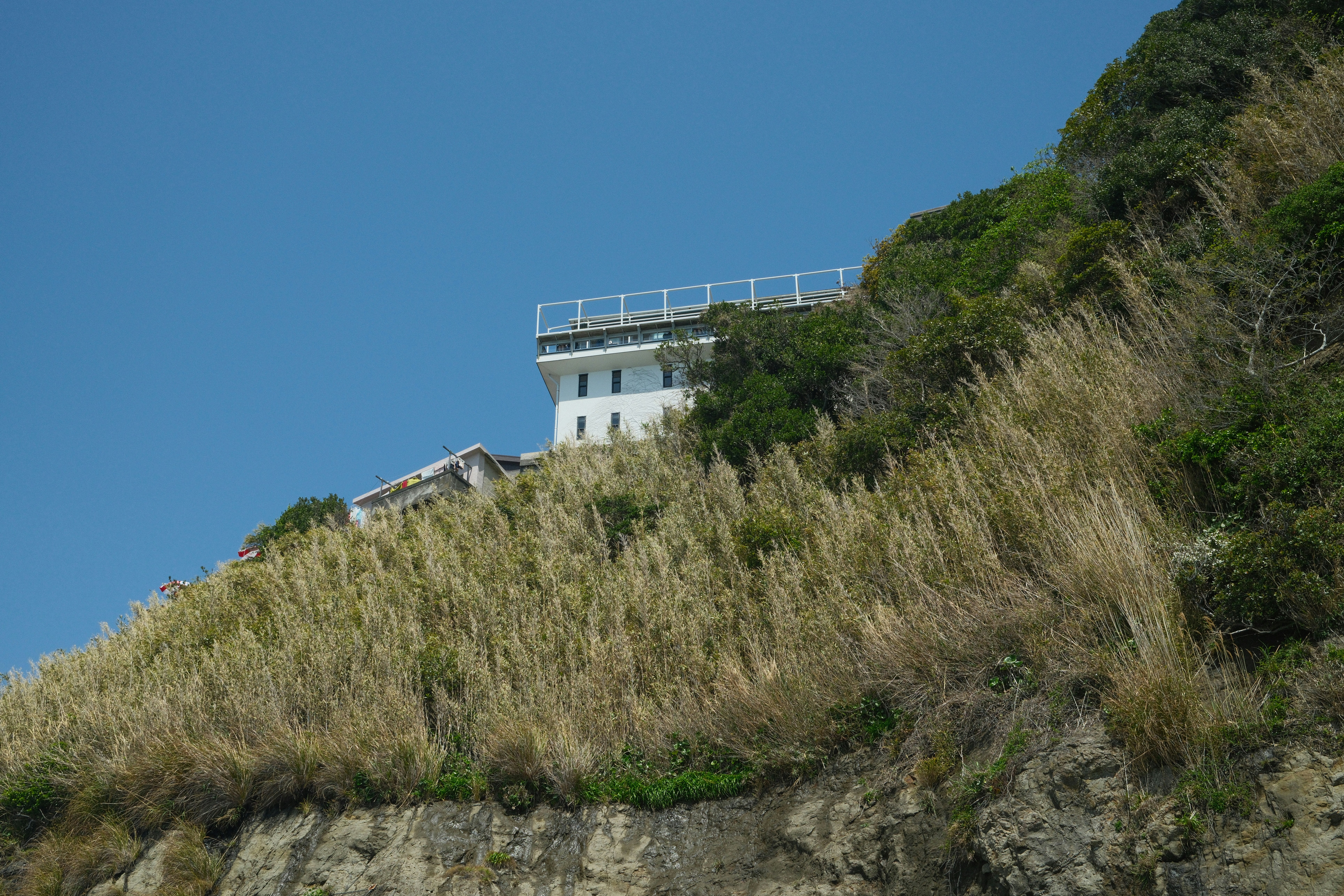White Lookout Resting on a Cliffside Crest