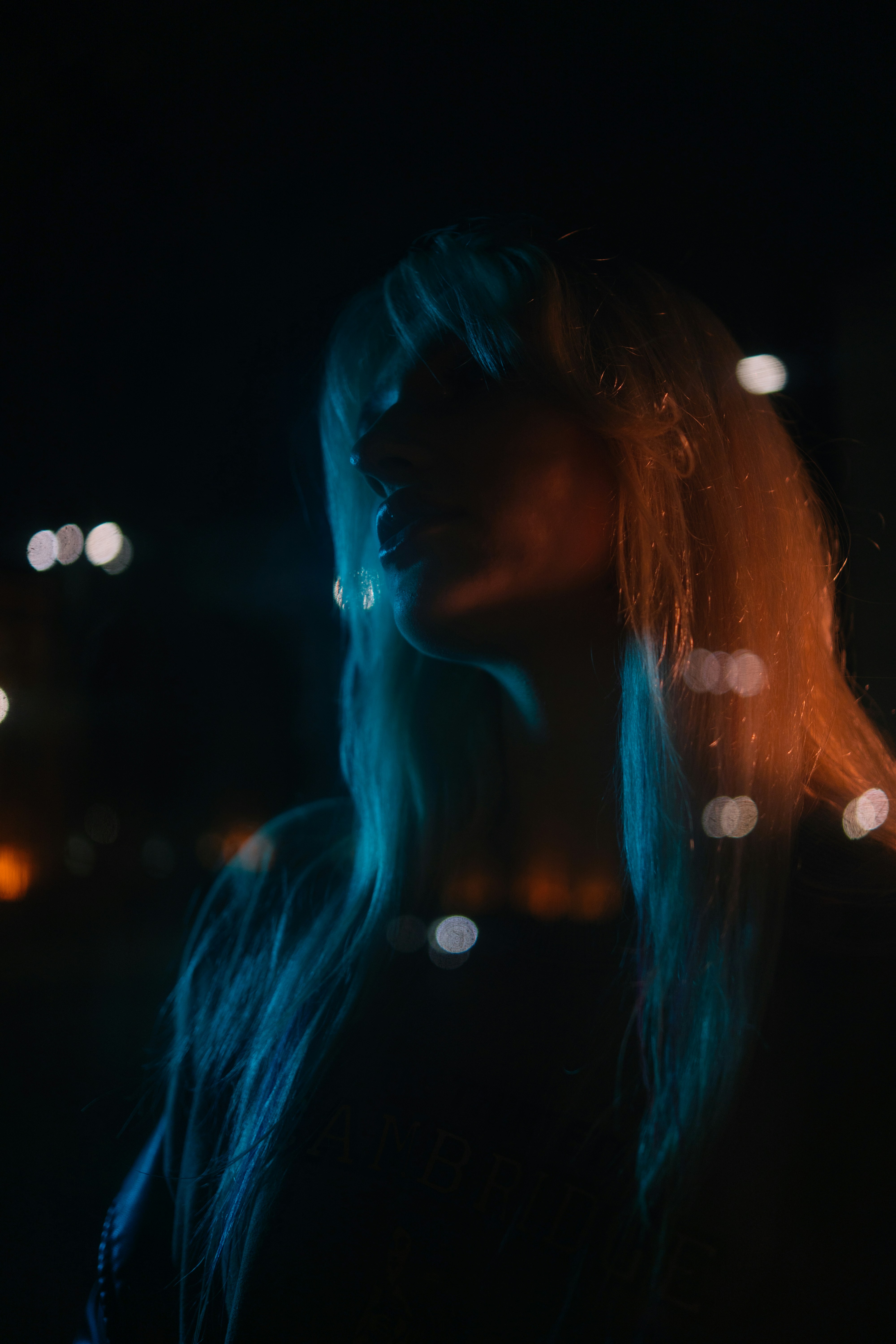 Neon Reverie: A Silhouetted Night Portrait