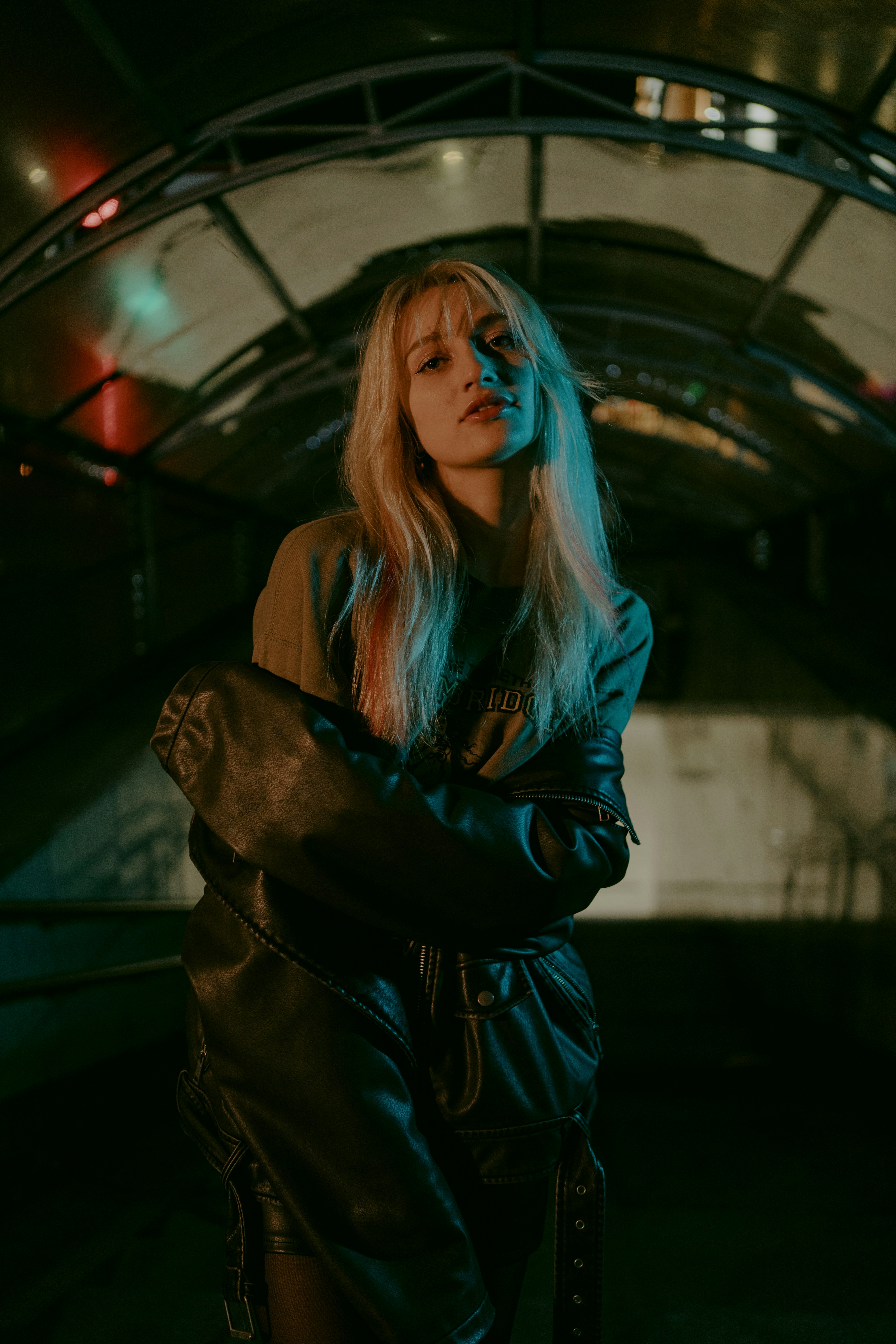 Neon-lit Confidence: A Stranger in the Tunnel