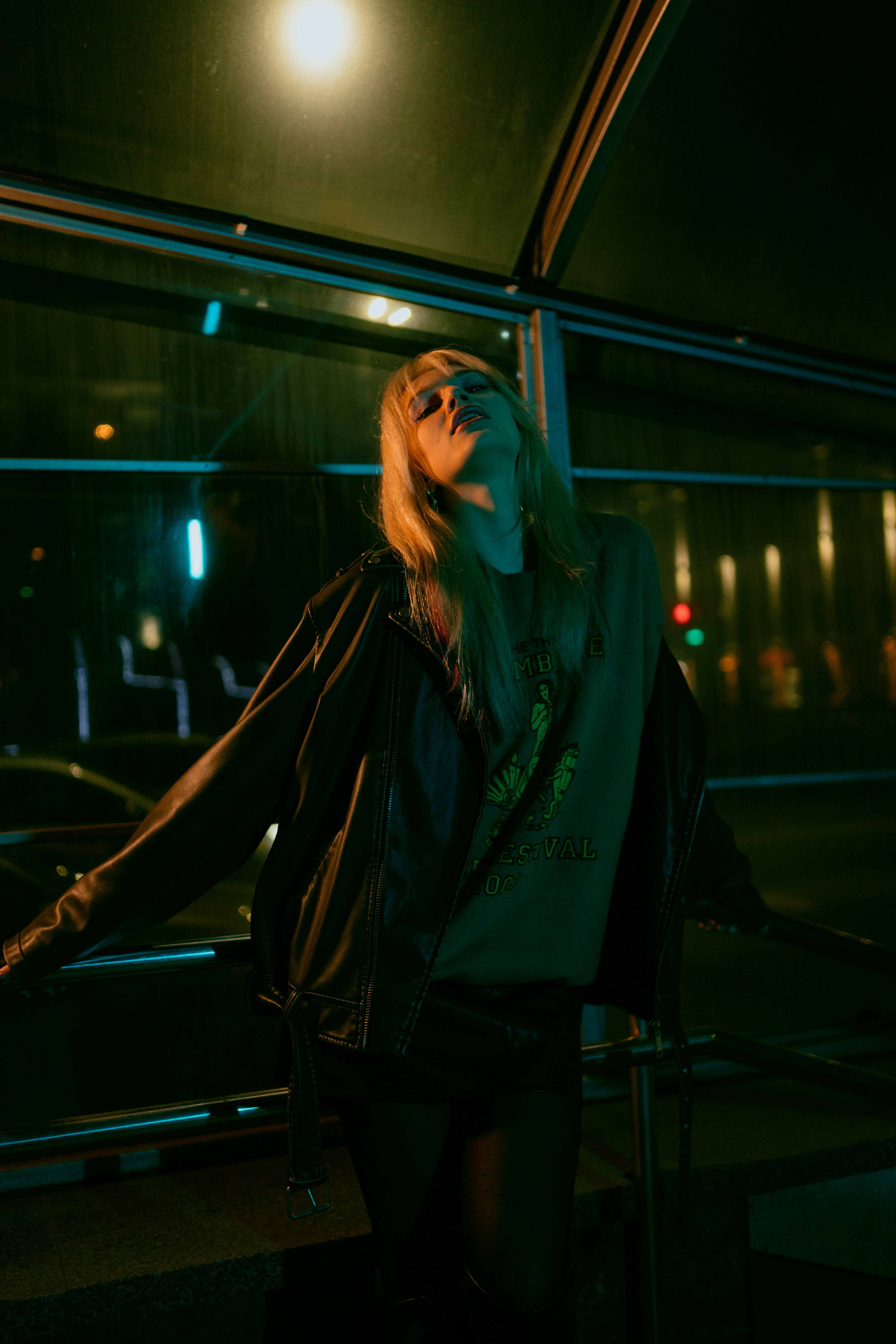 Neon Quiet: Night Portrait Under Glass Roof