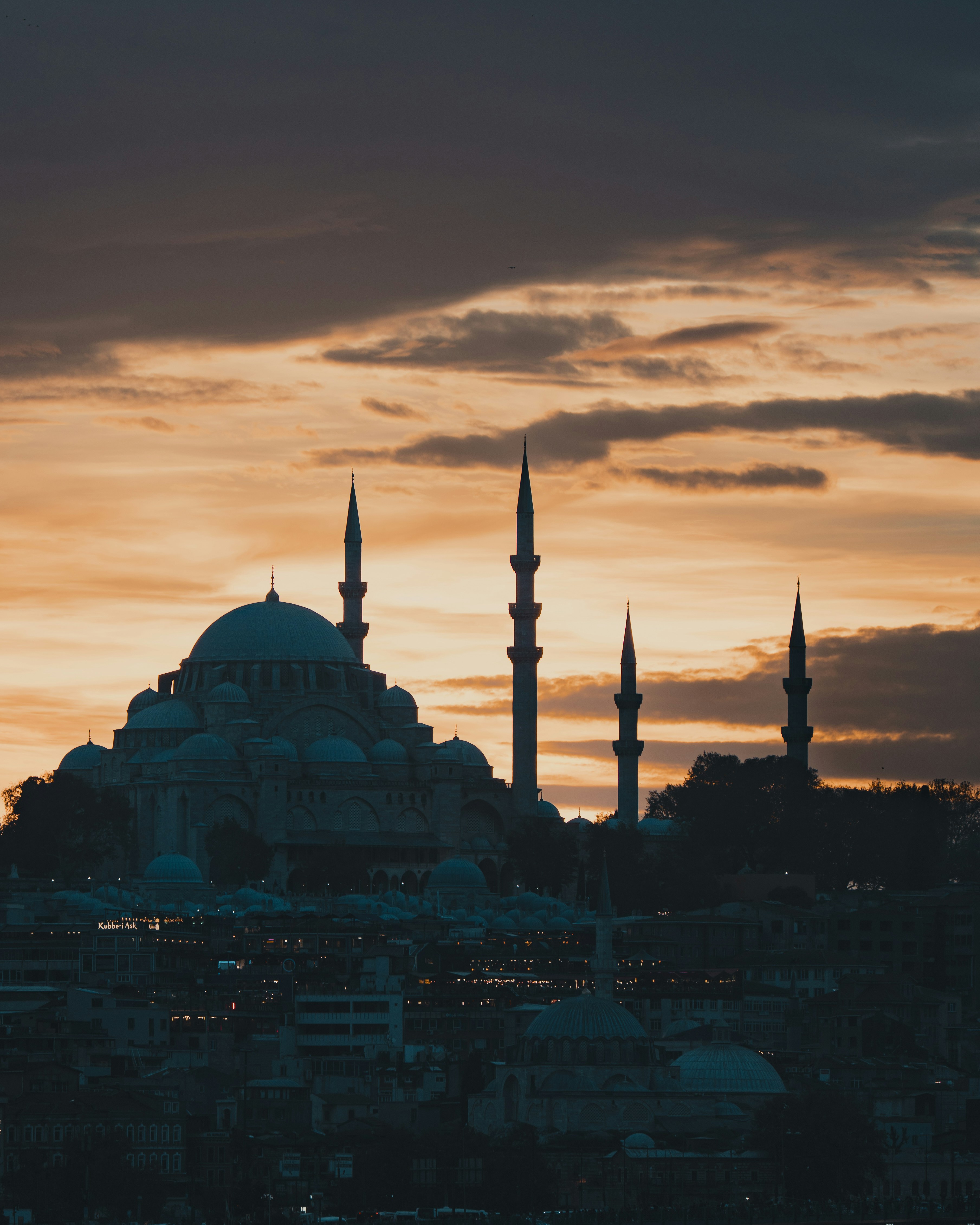 Twilight Silhouette Over Istanbul: Domes and Minarets Against a Warm Sky