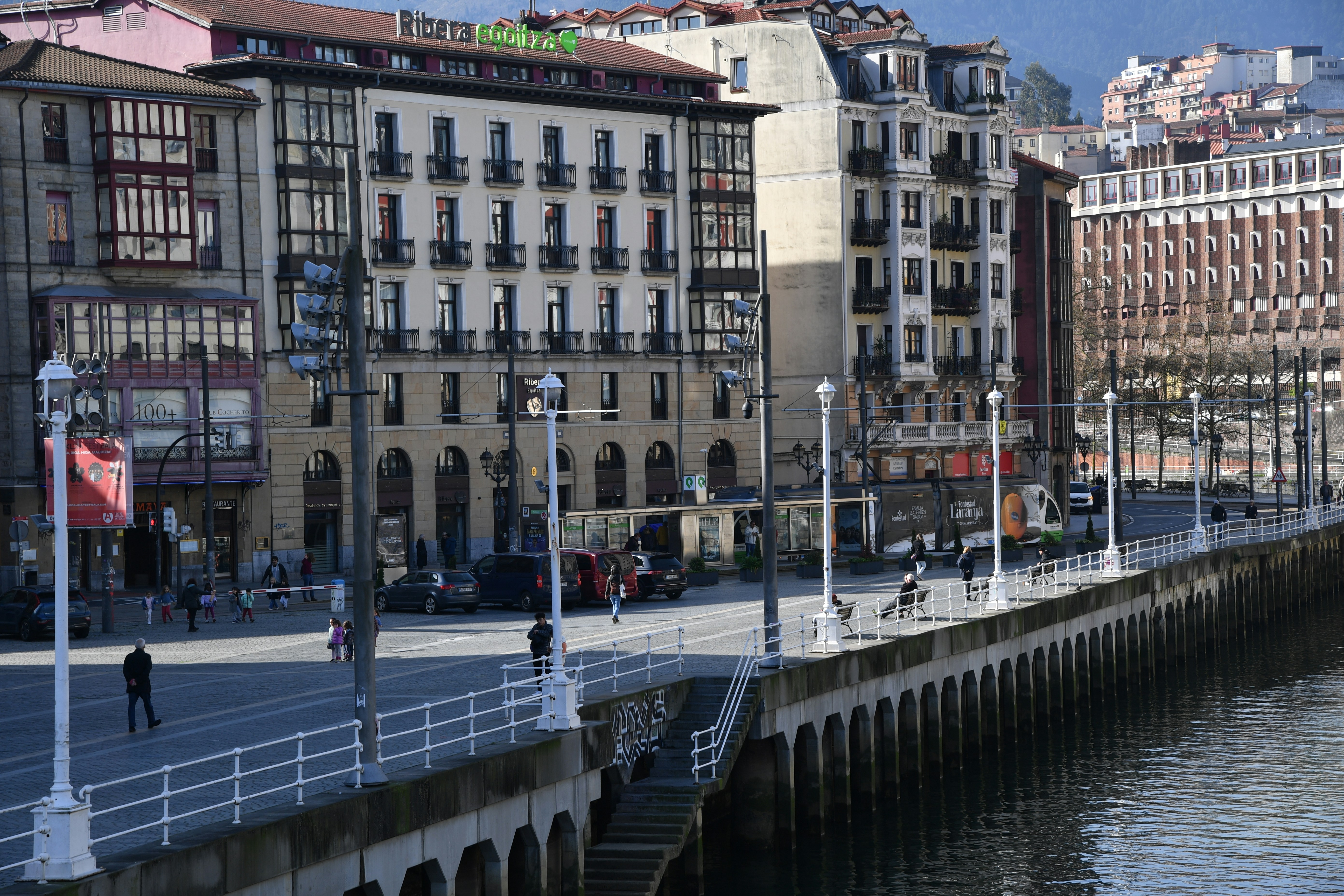 Riverfront Facades under a Pier of Repetition