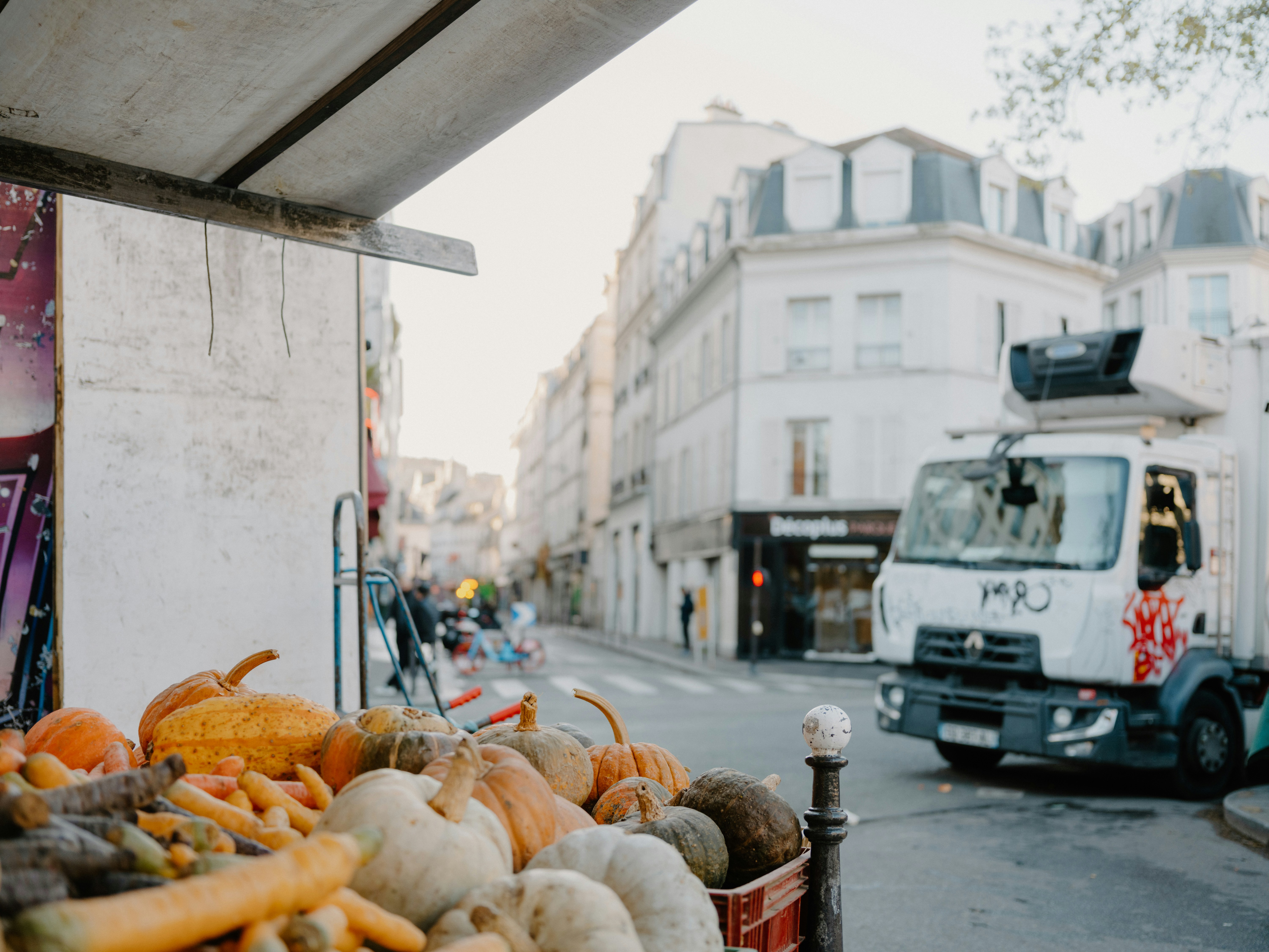 Market Bounty by the Street: Pumpkins and a City Truck