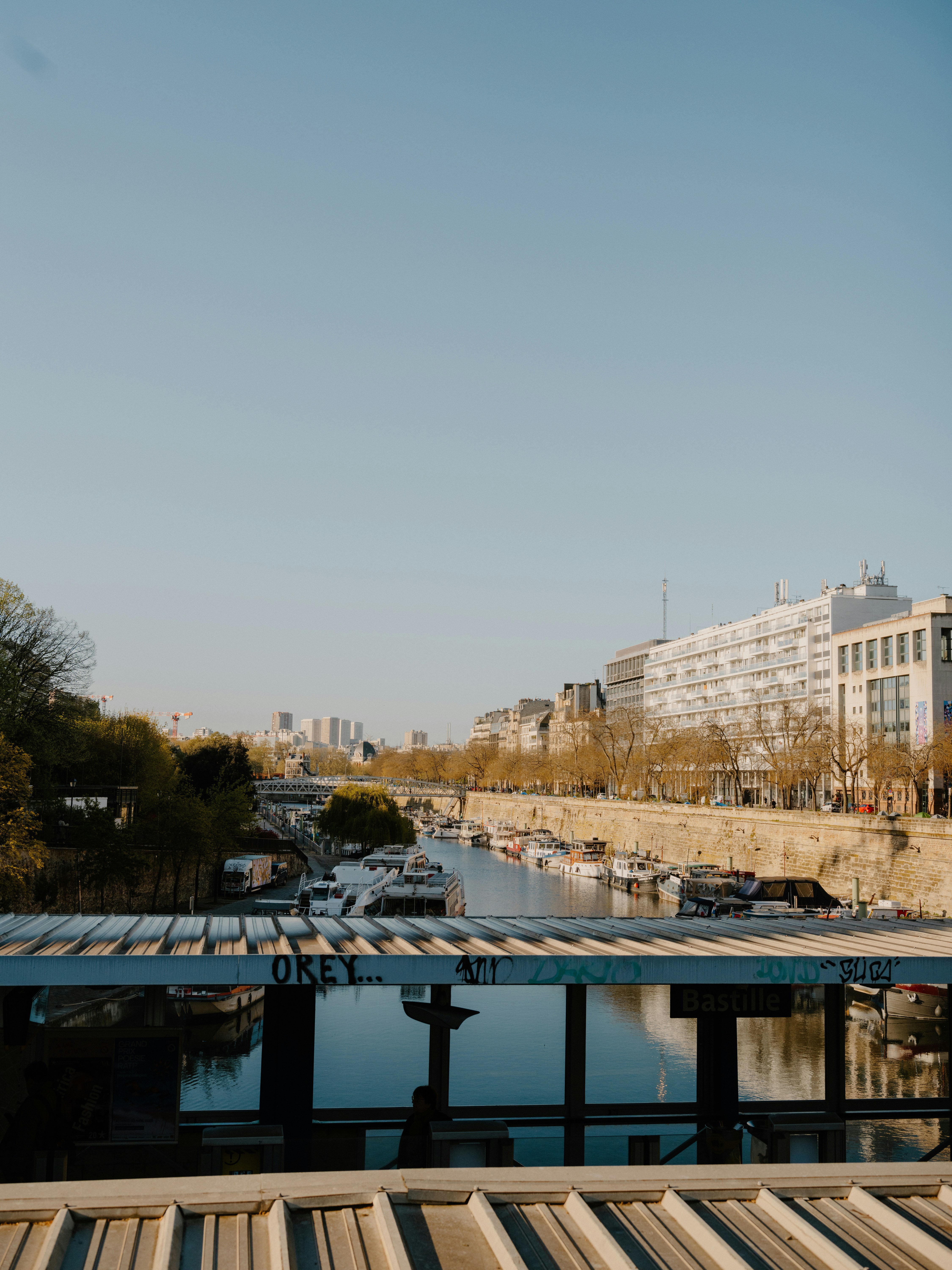 Riverine Boulevard: Boats, Reflections, and City Light
