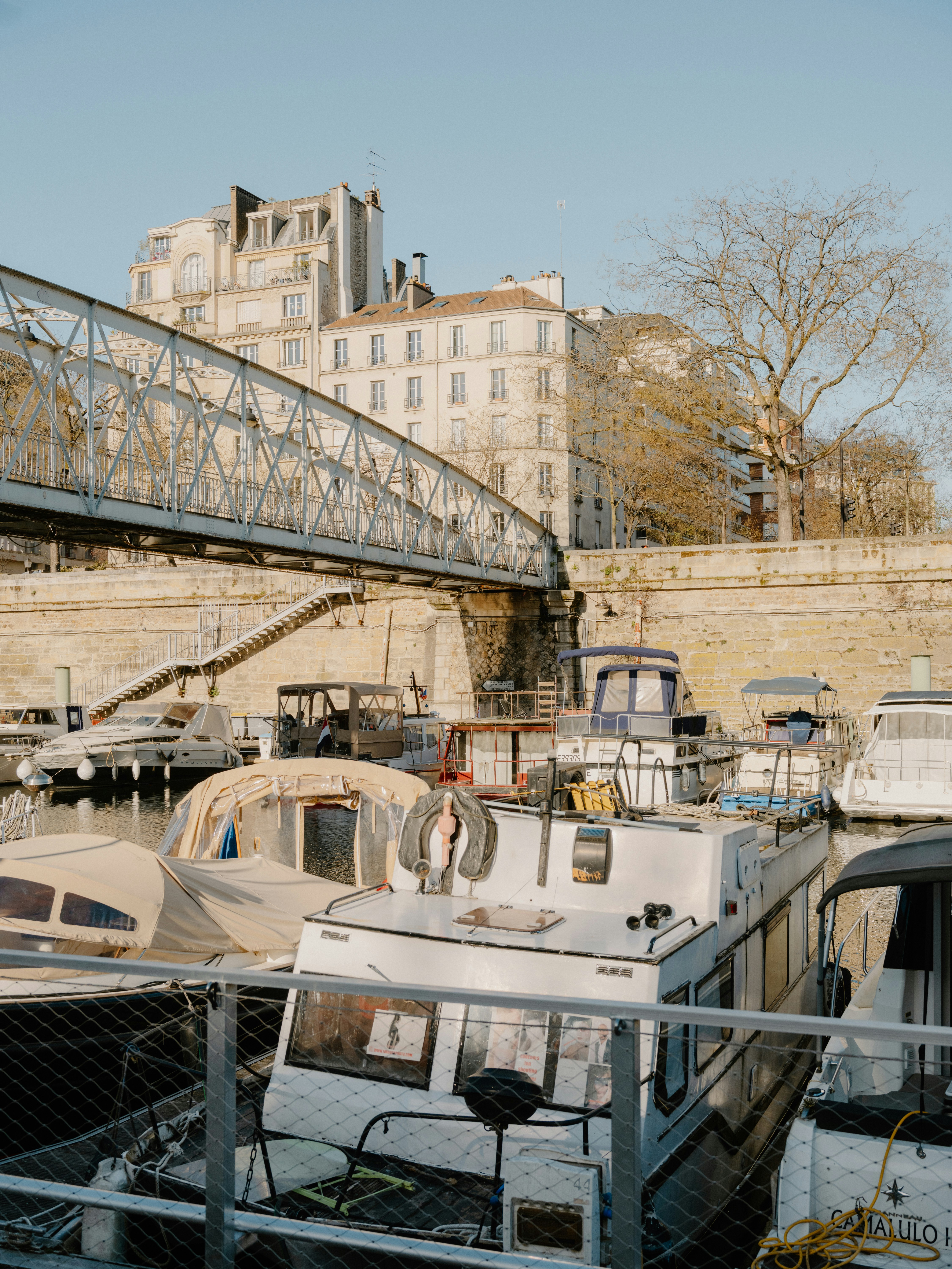 Boats at Rest Beneath a Timid Parisian Bridge