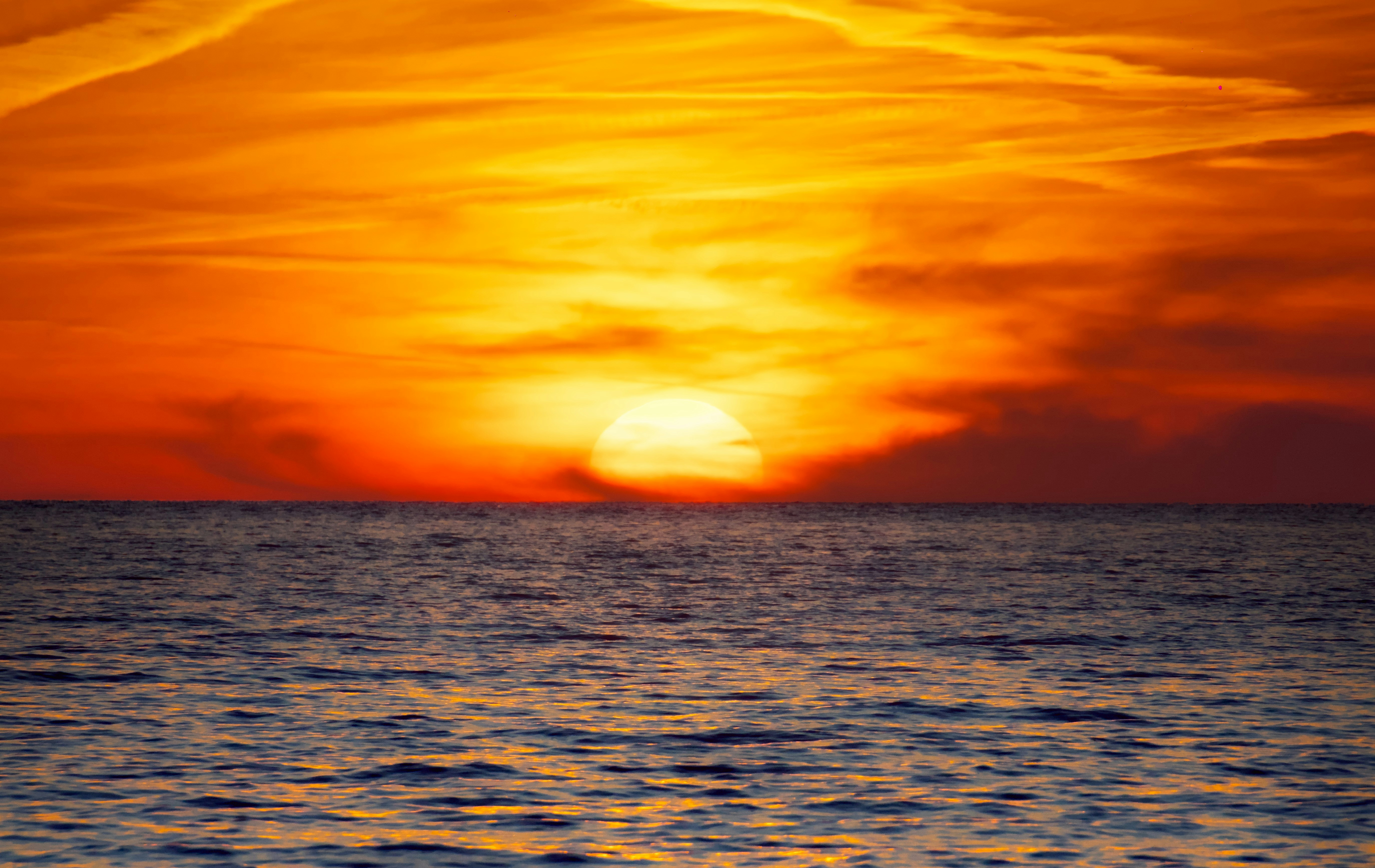 Sunlit Horizon: A Quiet Sea at Dusk